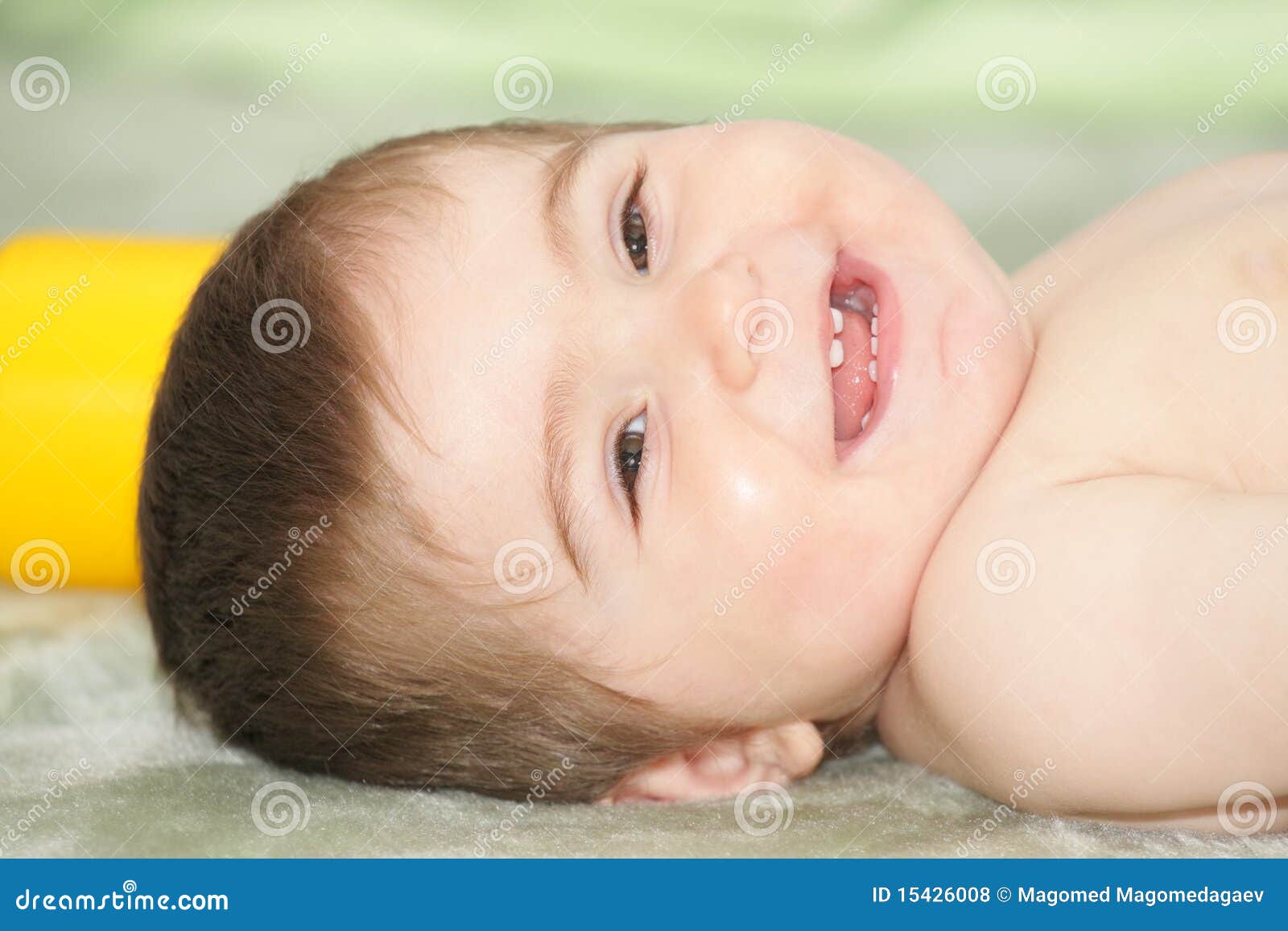 Baby laying down on rug stock photo. Image of cute, green - 15426008