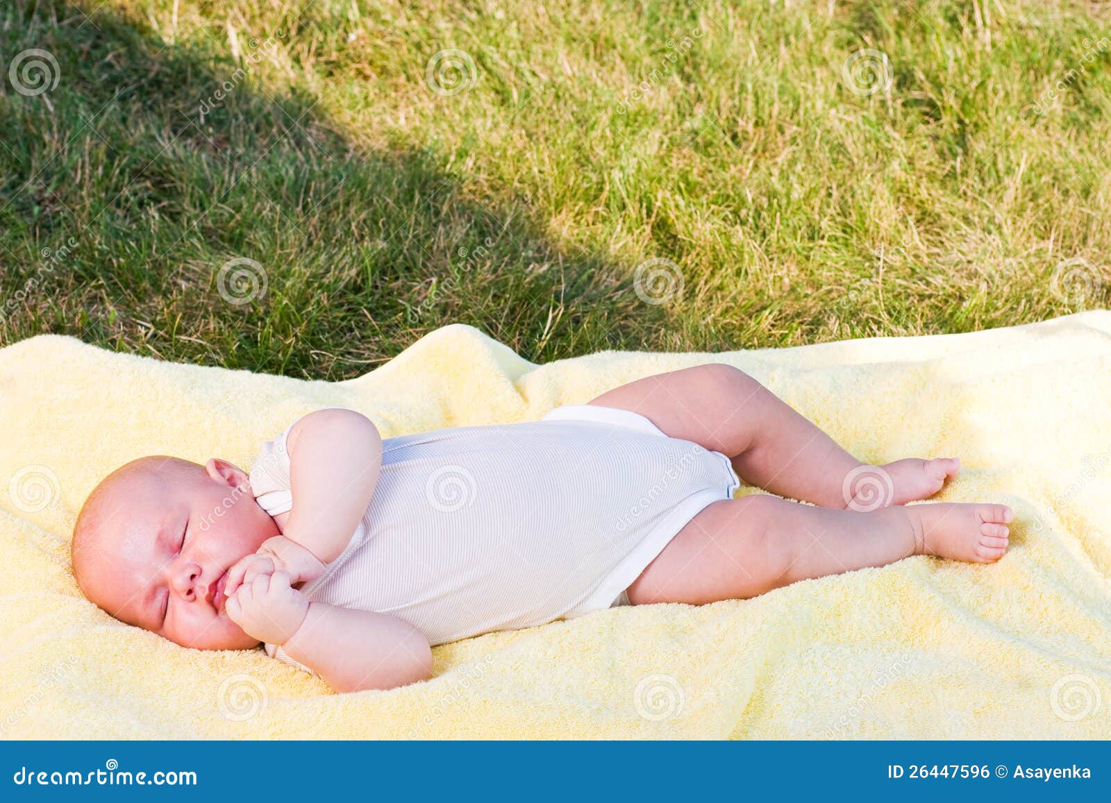 Baby laying on the grass stock photo. Image of cute, lying - 26447596