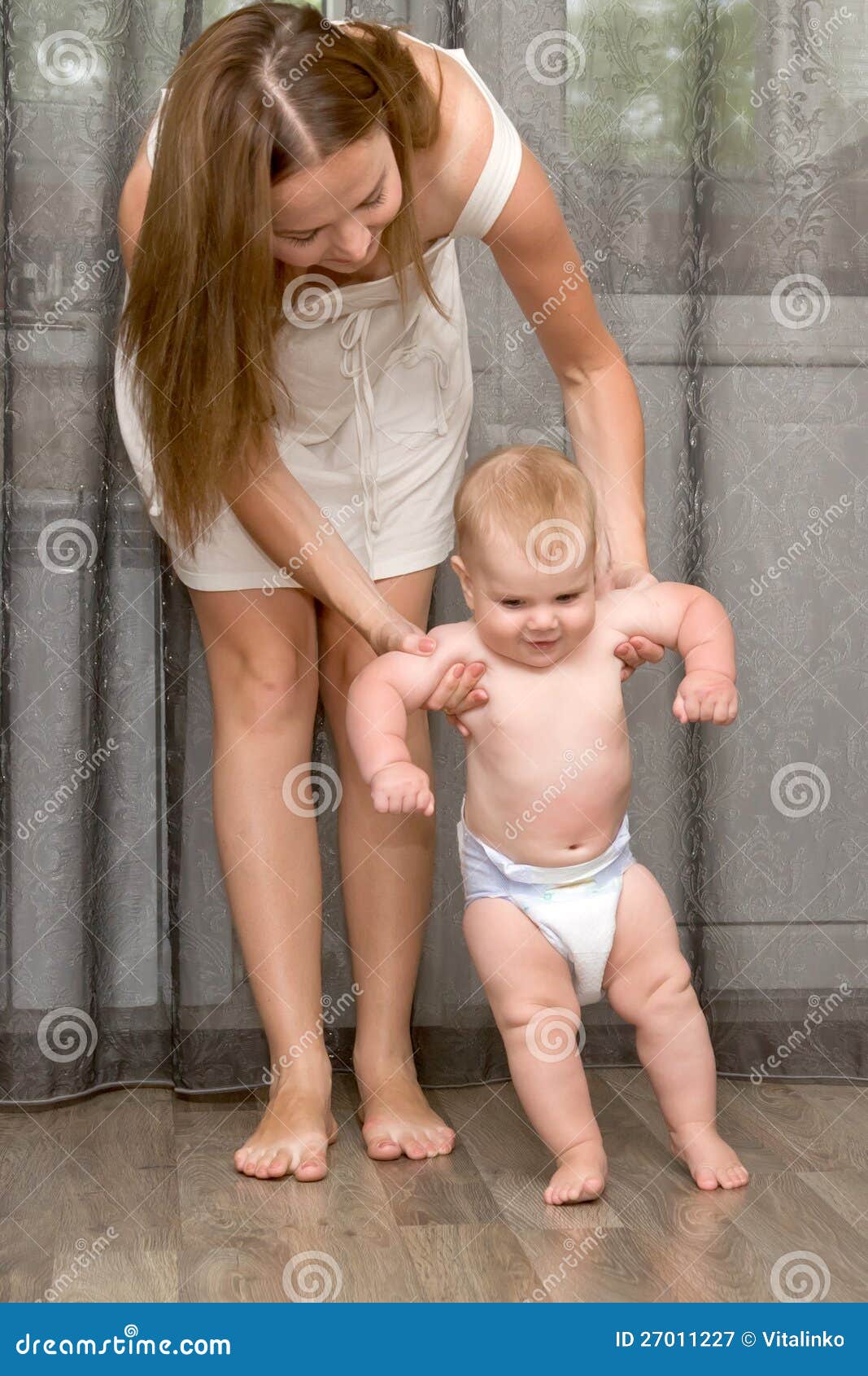 Baby learning to walk stock image. Image of expression - 27011227