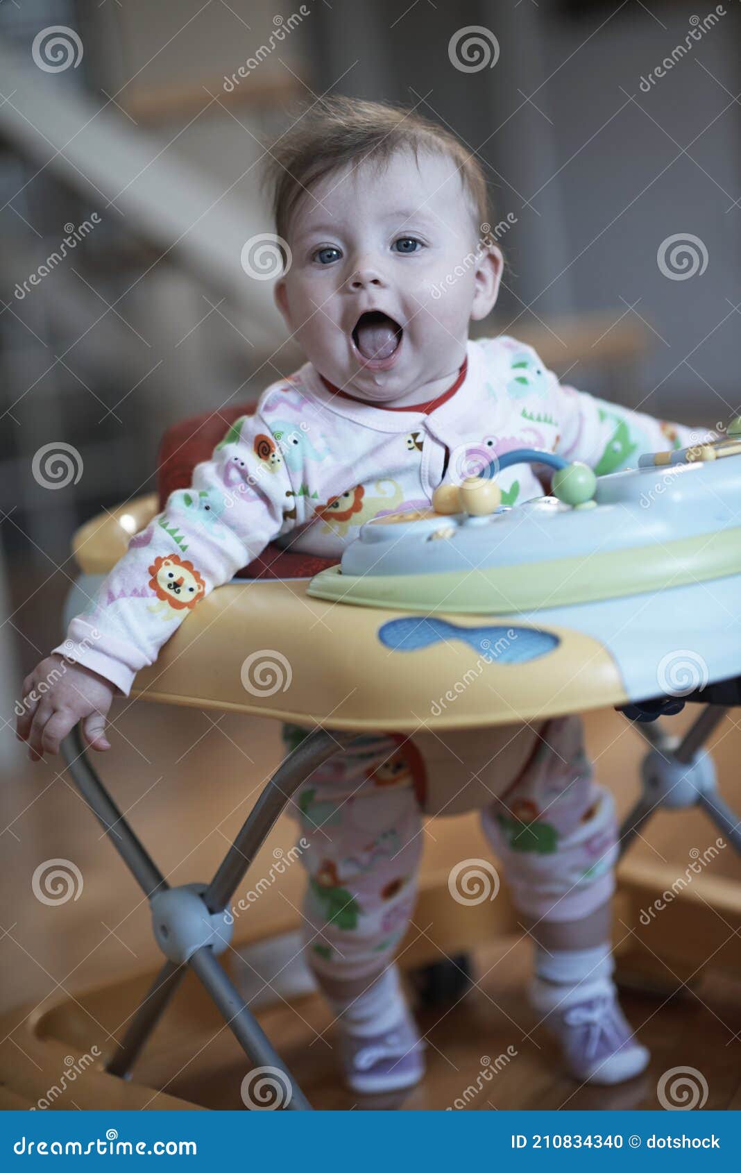 Baby Learning To Walk in Walker Stock Photo - Image of cheerful, roller ...