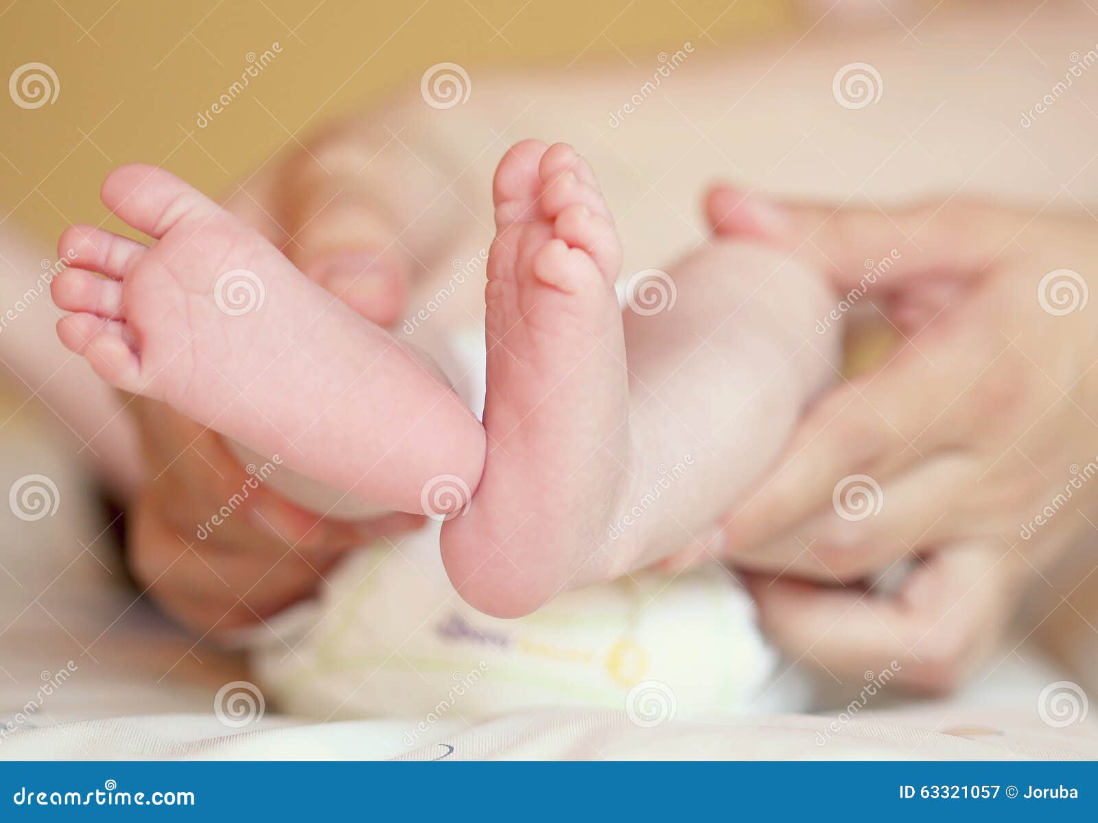 Baby leg stock image. Image of safety, tiny, care, palm - 63321057