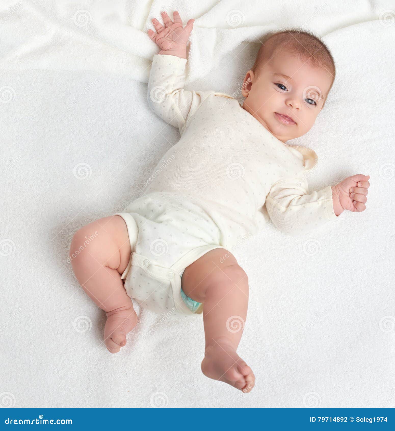 Baby Lie on White Towel in Bed, Top View Stock Photo - Image of male ...