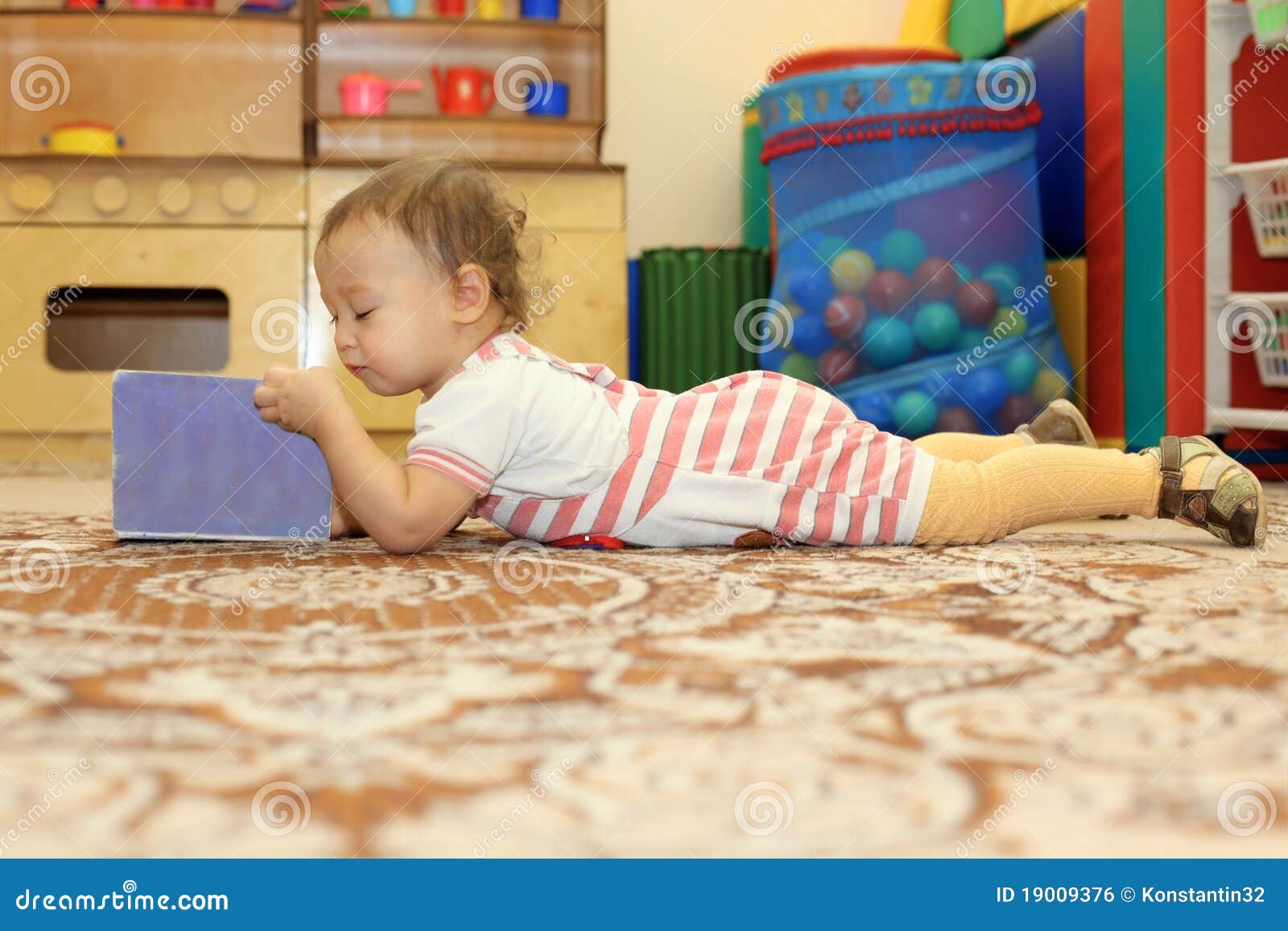Baby look in book stock photo. Image of education, little - 19009376