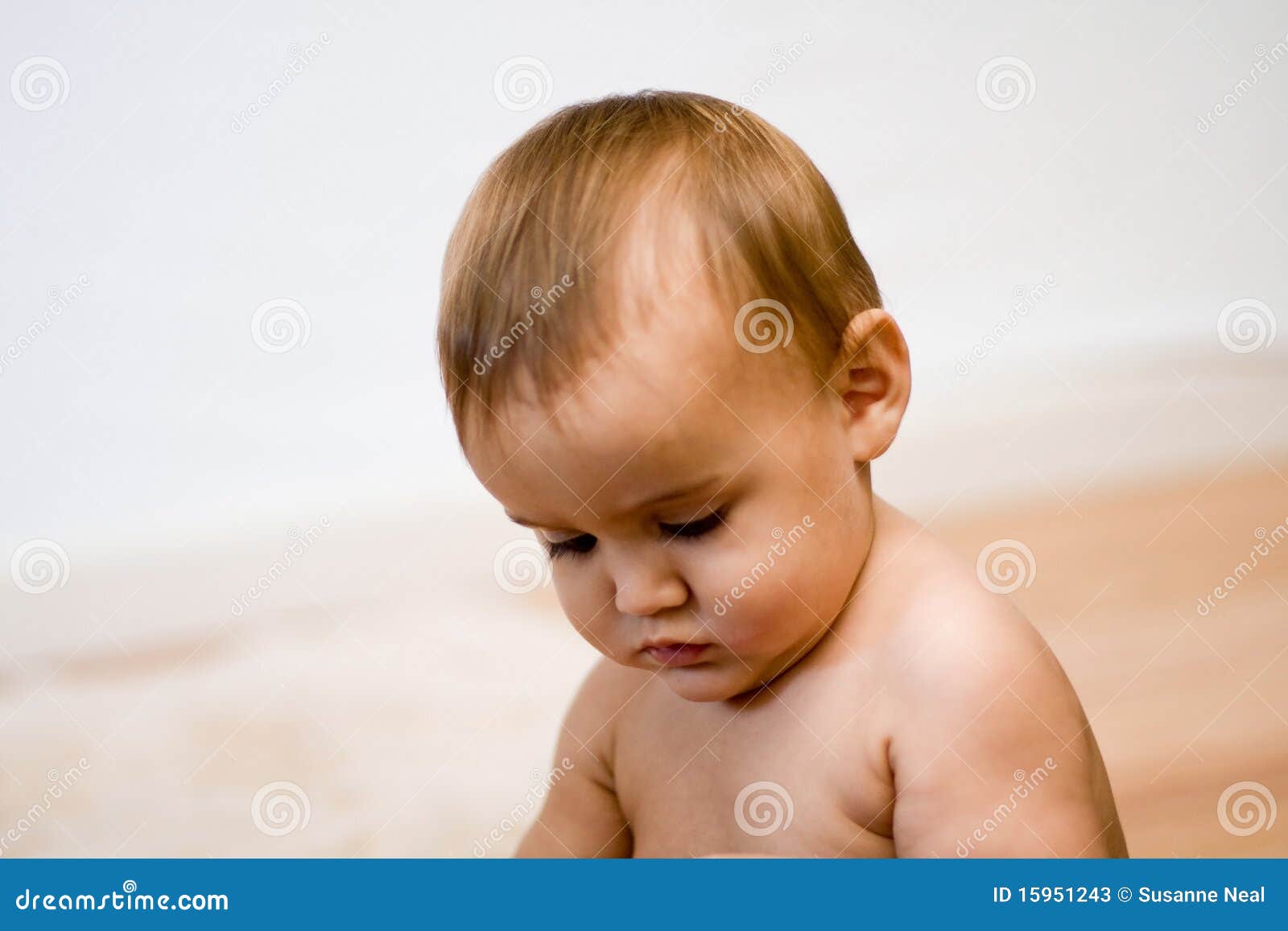 Baby looking downward stock image. Image of cheeks, precious - 15951243