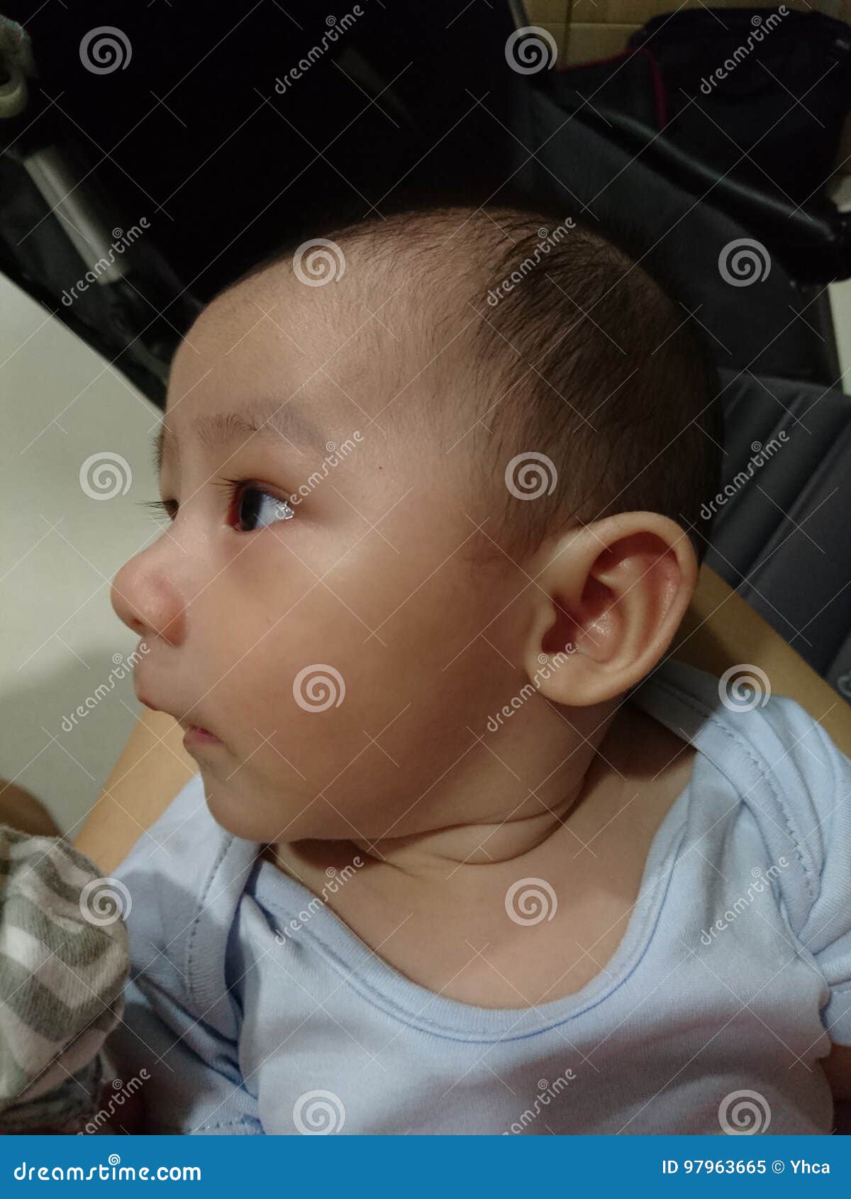 Baby looking at his side stock image. Image of four, looking - 97963665