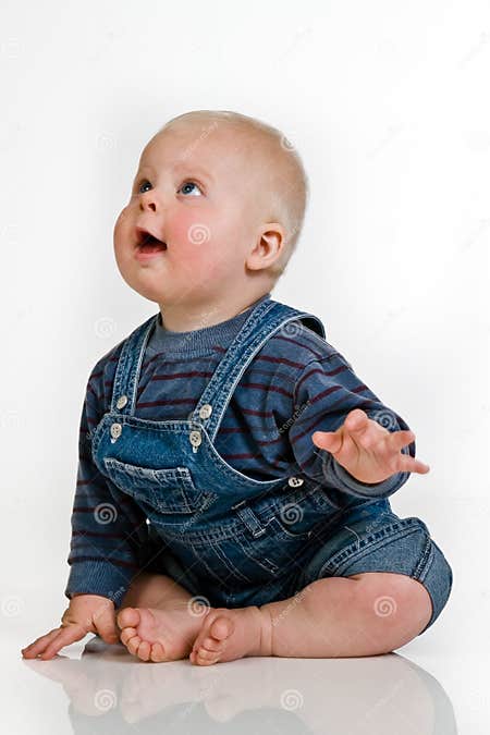 Baby Looking Left in Studio Stock Image - Image of studio, dungerees ...