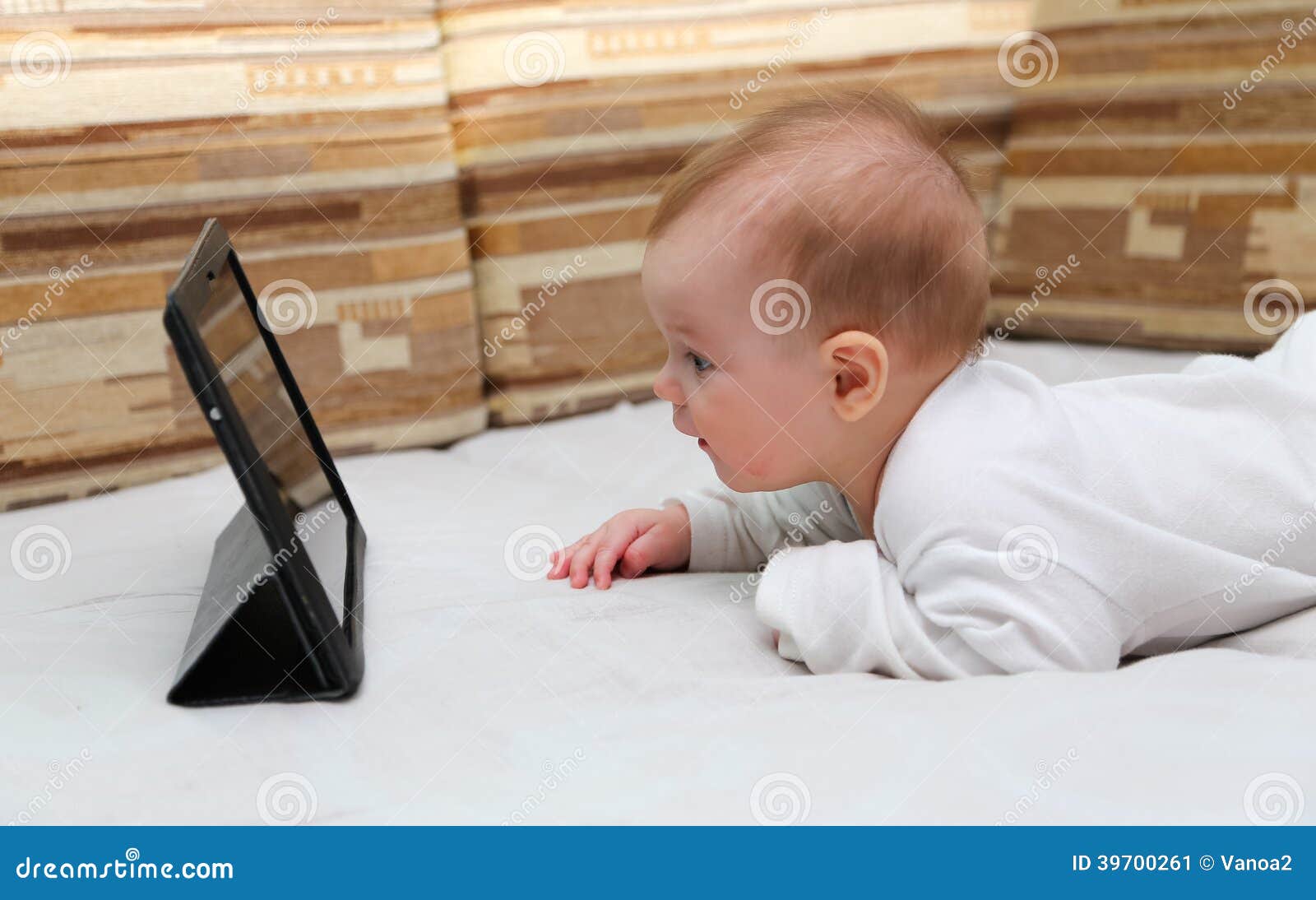 Baby Looking at a New Tablet PC Stock Image - Image of lying, baby ...
