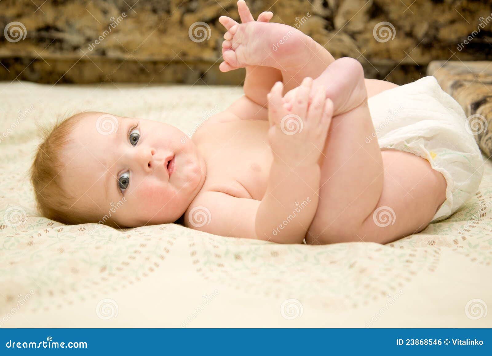Baby lying on back stock photo. Image of joyful, fingers - 23868546