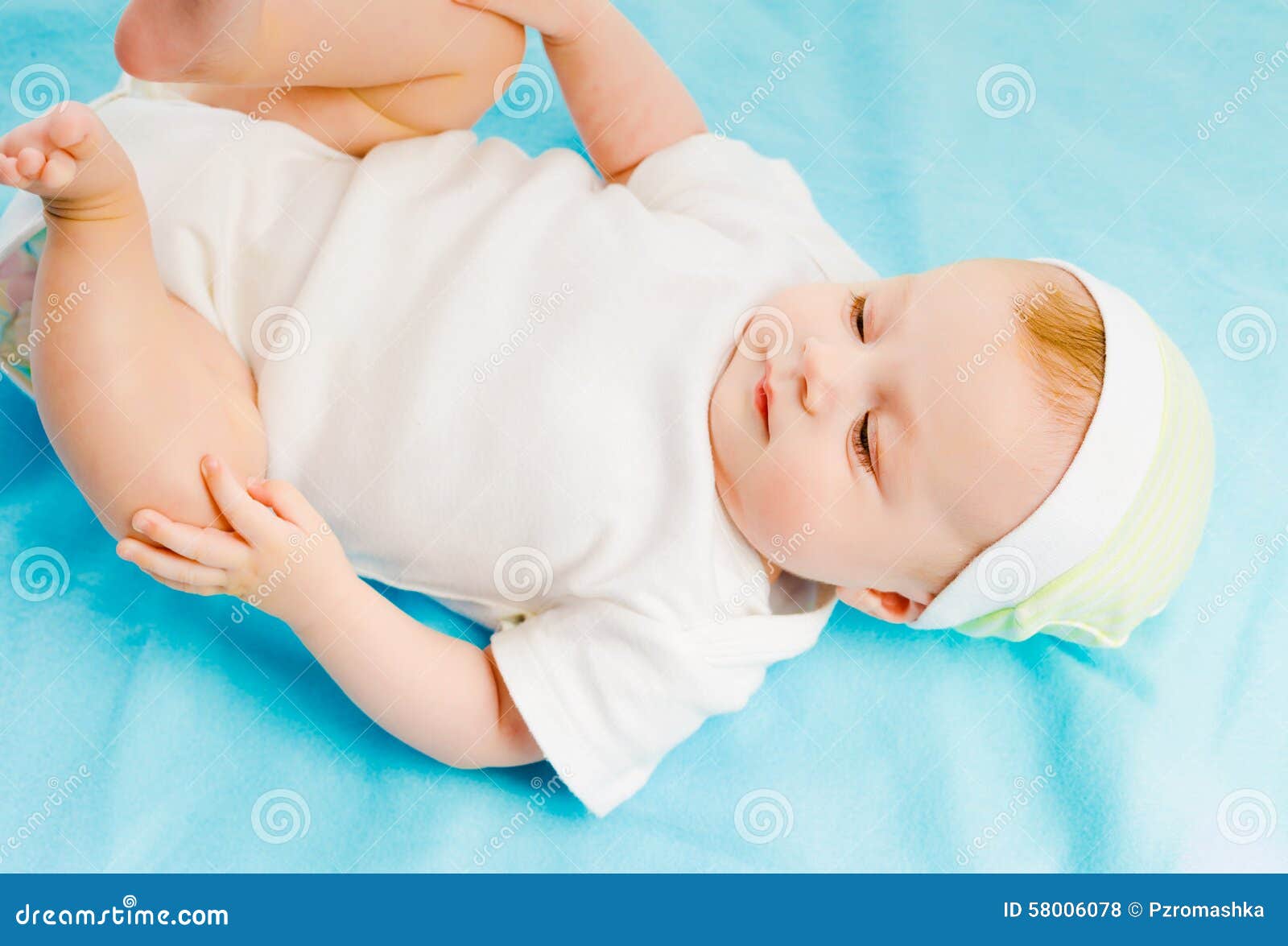 Baby lying on a blue plaid stock photo. Image of newborn - 58006078