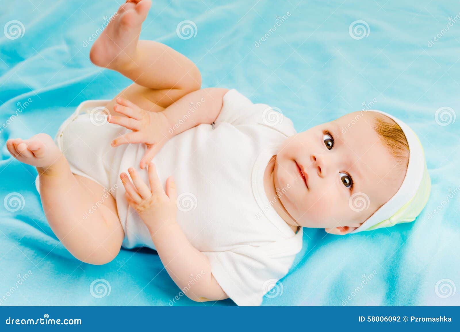 Baby lying on a blue plaid stock photo. Image of healthy - 58006092