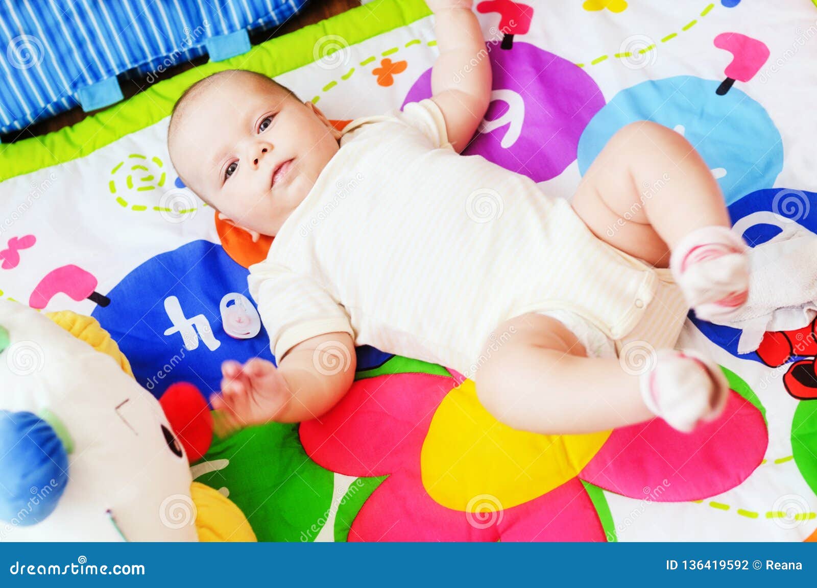 Baby Lying on Developing Rug Stock Photo - Image of move, cute: 136419592