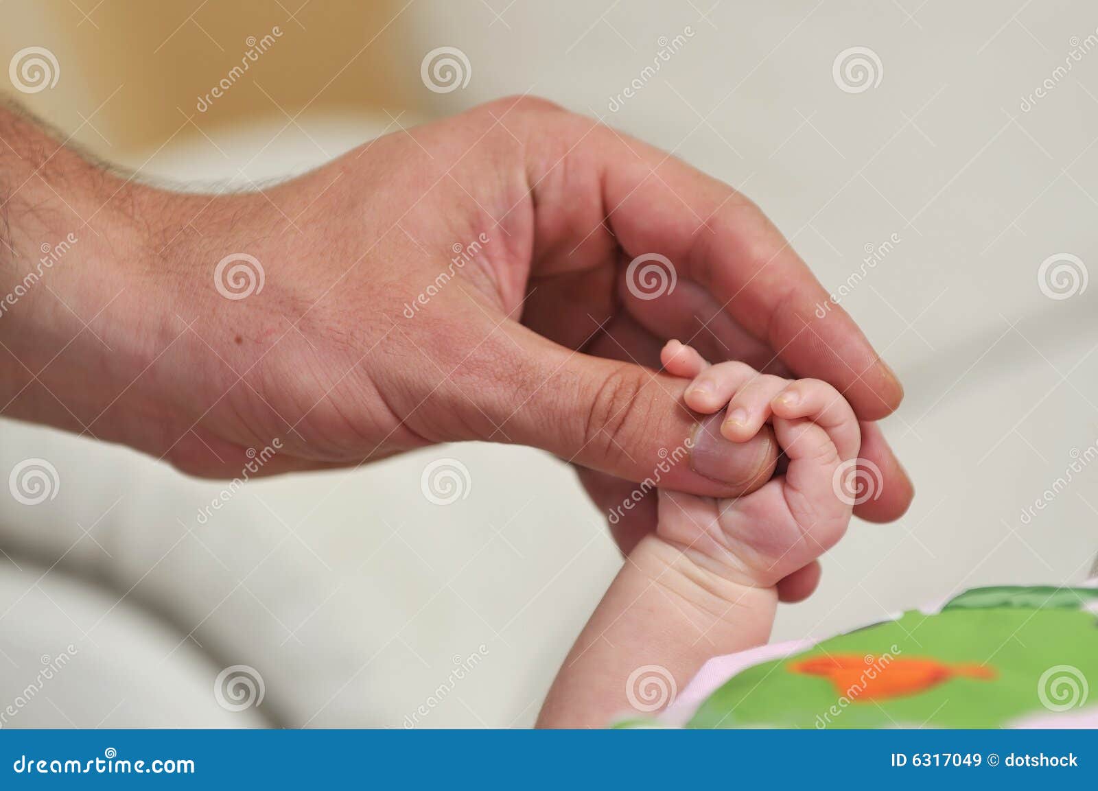 Baby and man hand touch stock image. Image of help, feel - 6317049