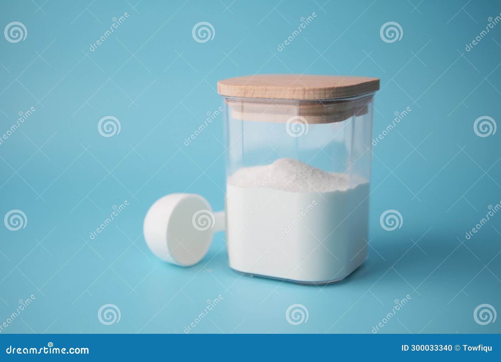 Baby Milk Powder in Container with a Spoon on Blue Background. Stock ...