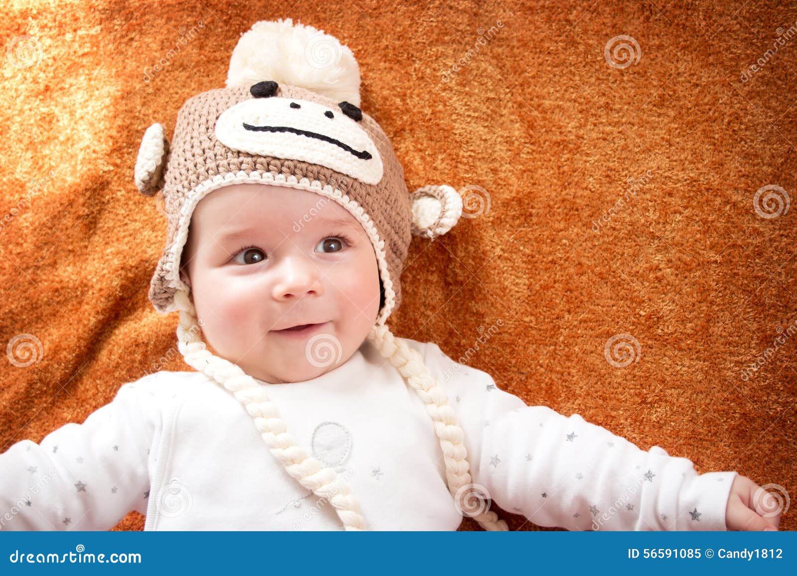 Baby in monkey hat stock image. Image of cute, happiness - 56591085