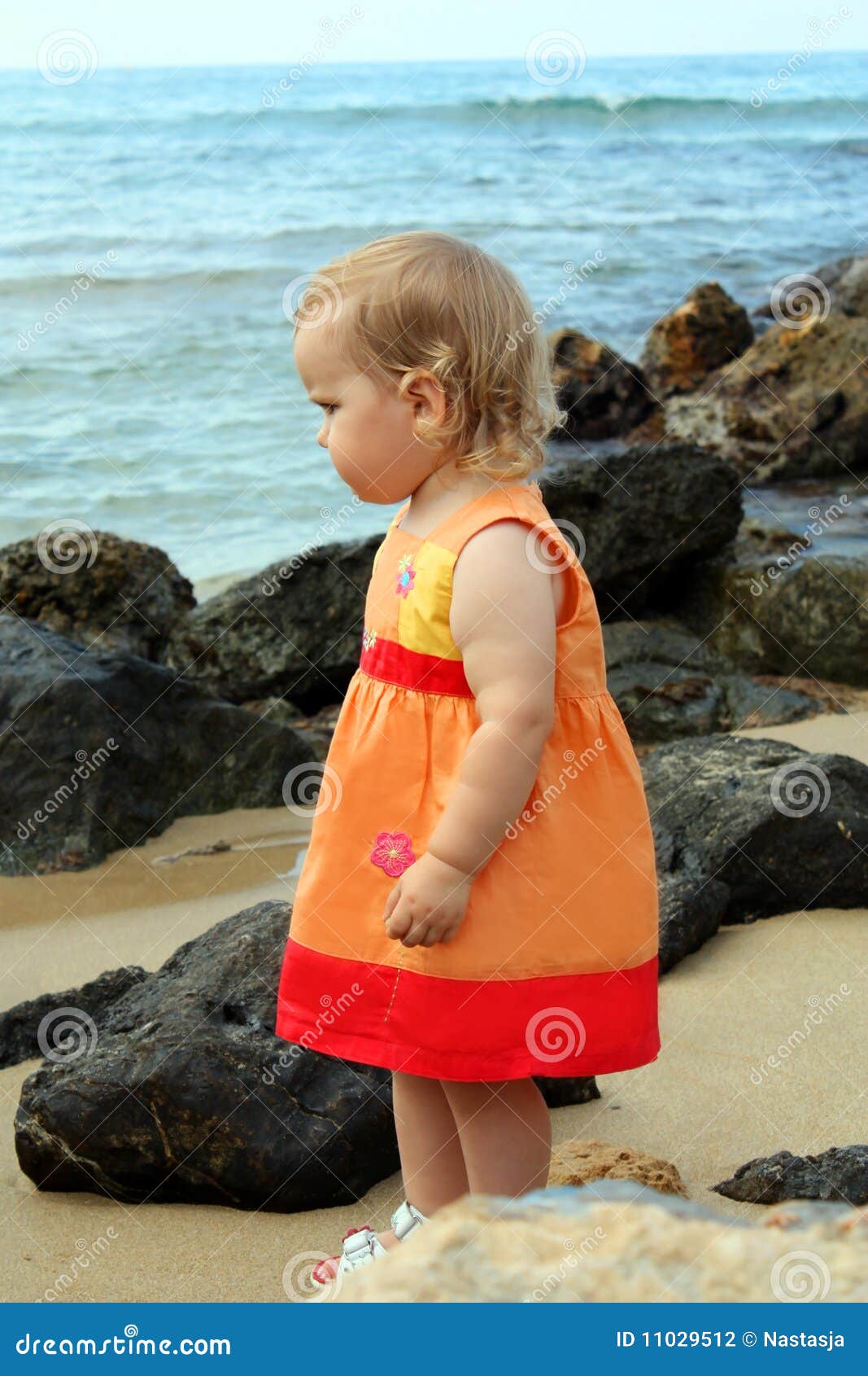Baby near the sea stock photo. Image of coastline, sand - 11029512
