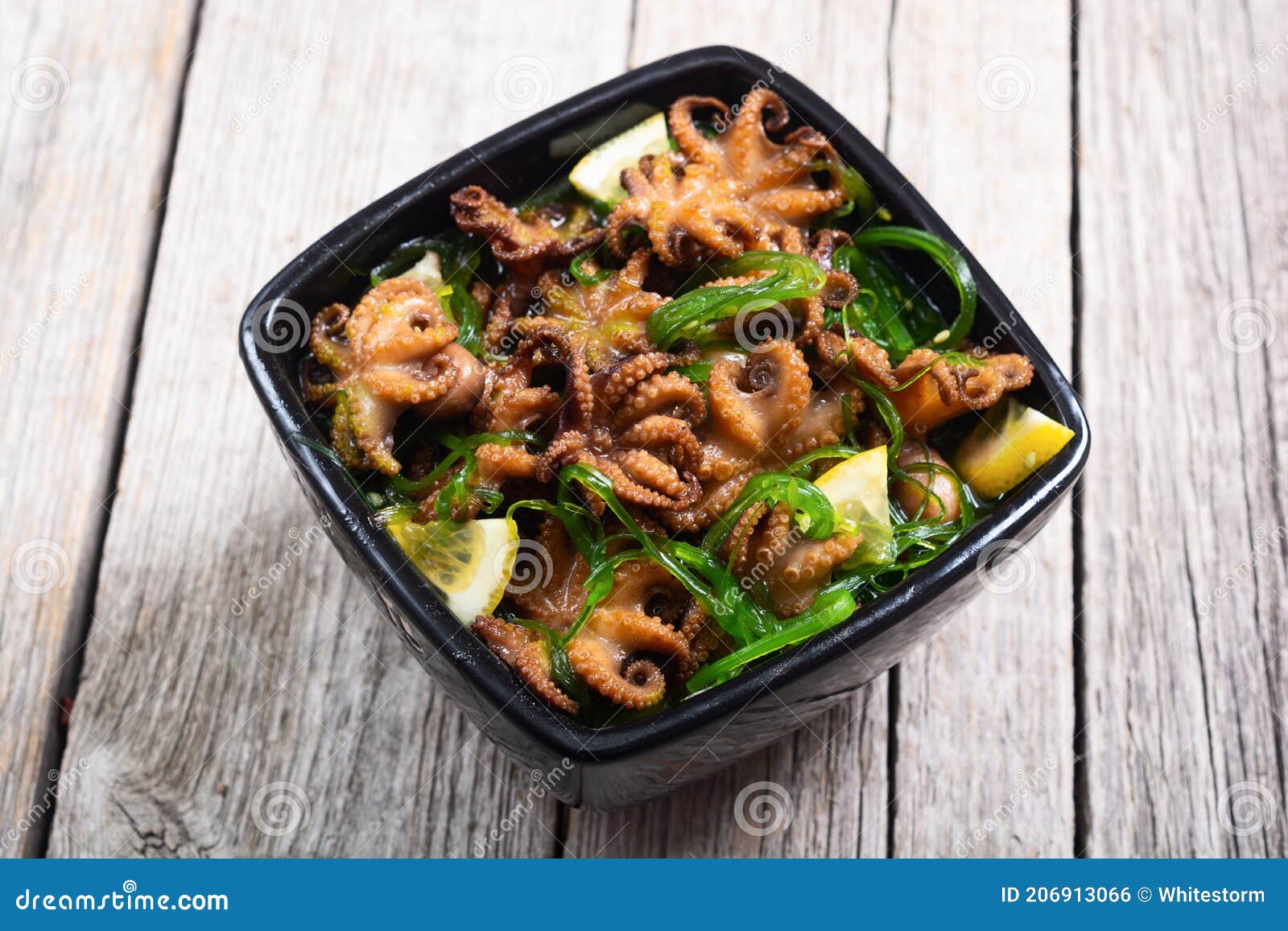 Baby Octopus Fried with Lemon Stock Photo - Image of meal, marinated ...