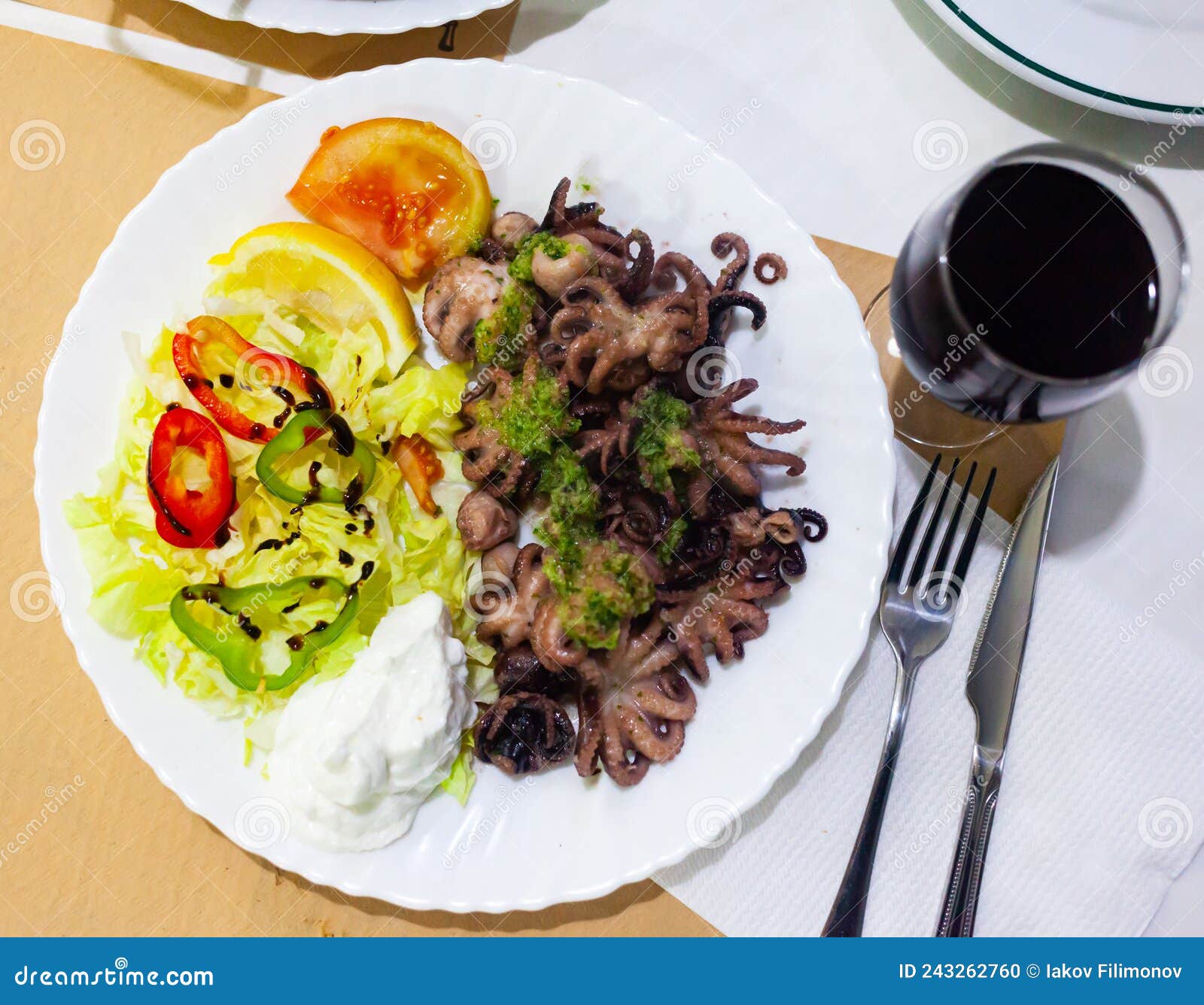 Baby octopus with salad stock photo. Image of feeding - 243262760