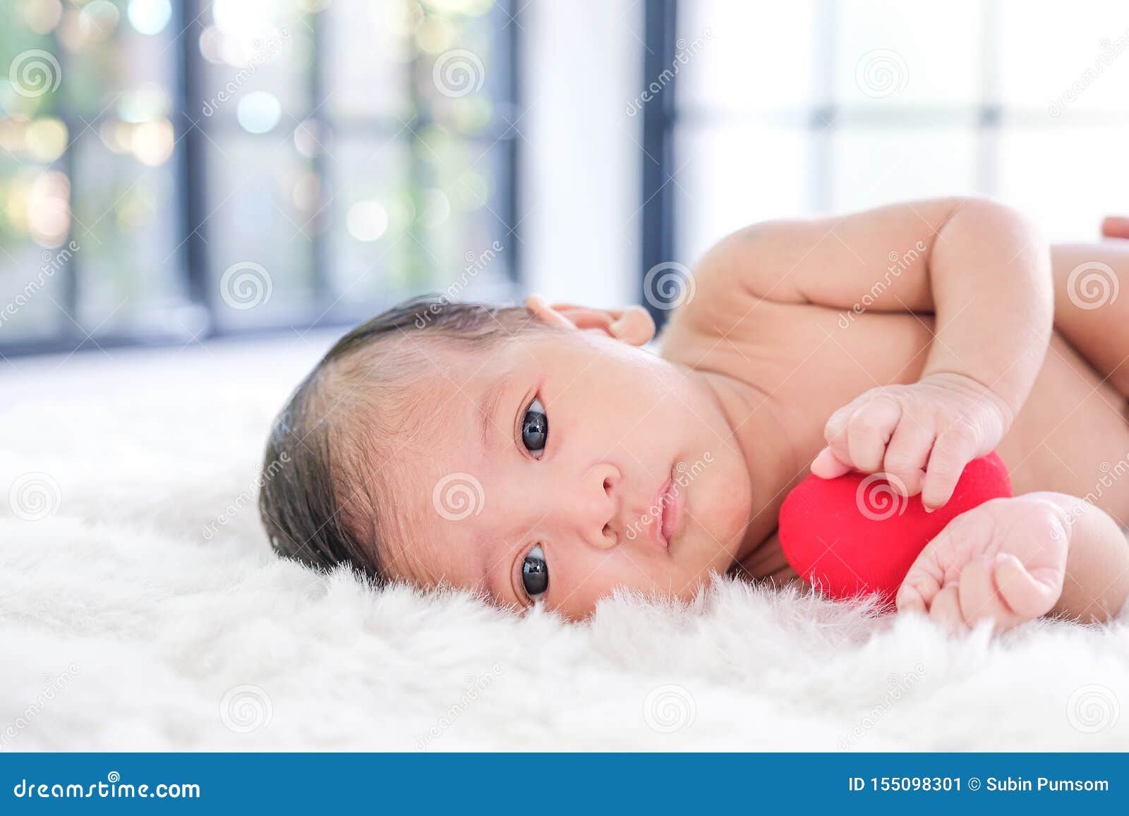 The Baby is Open in the Bed in Room Stock Image - Image of look, beauty ...