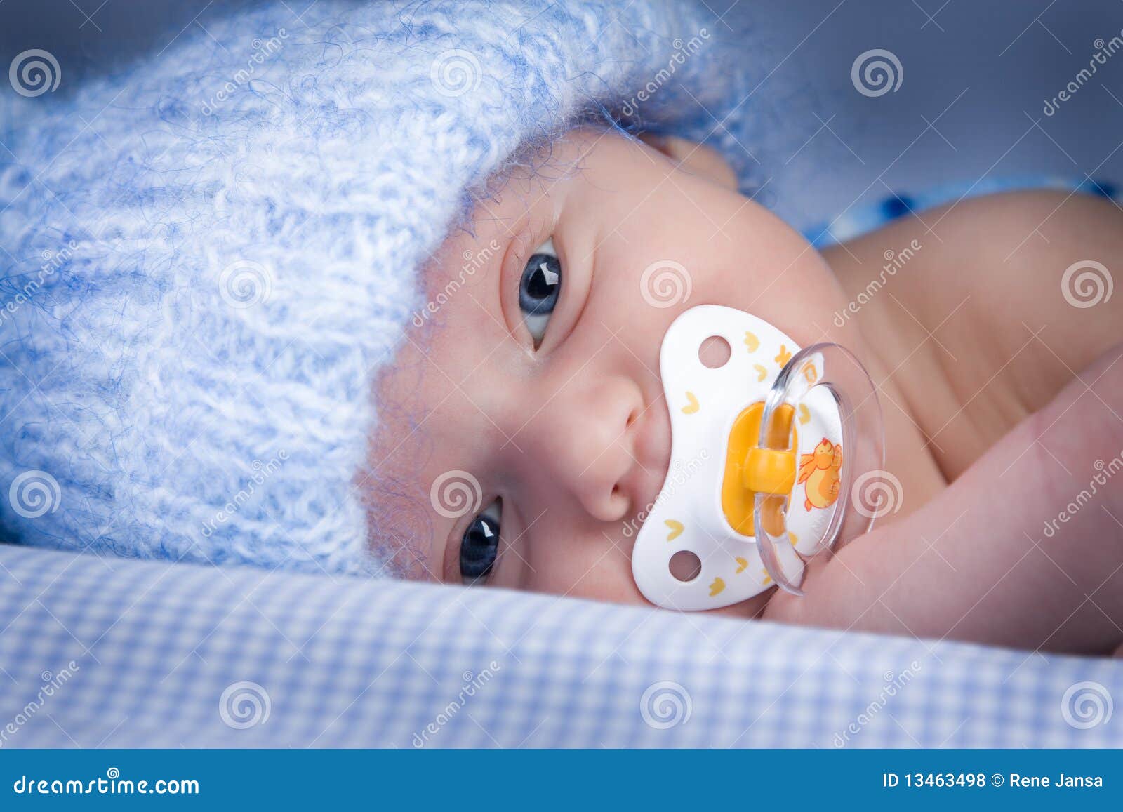 Baby with pacifier stock photo. Image of looking, tired - 13463498
