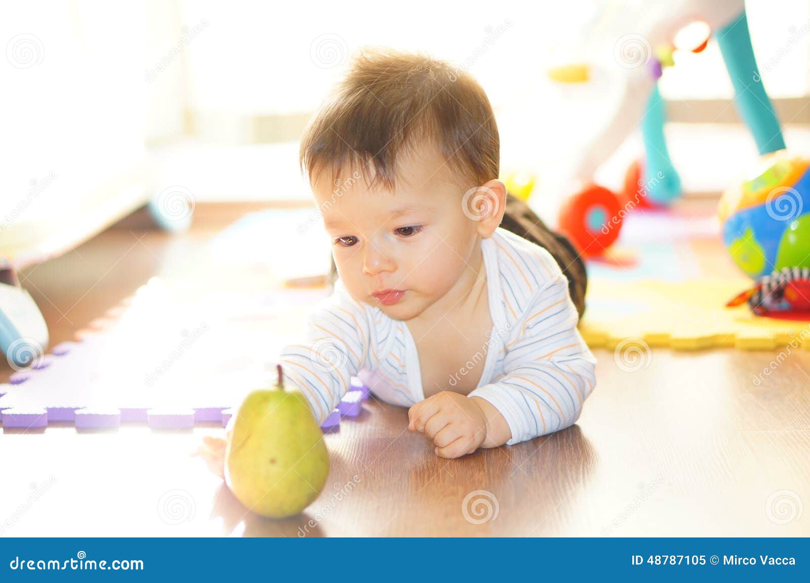 Baby and pear stock image. Image of pear, green, lying - 48787105