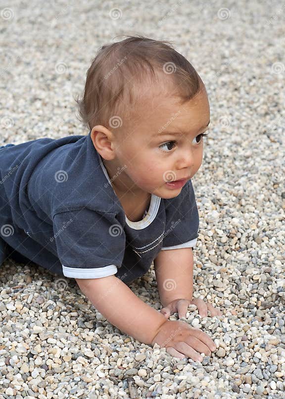 Baby in pebbles stock photo. Image of blue, stones, enjoy - 27721728