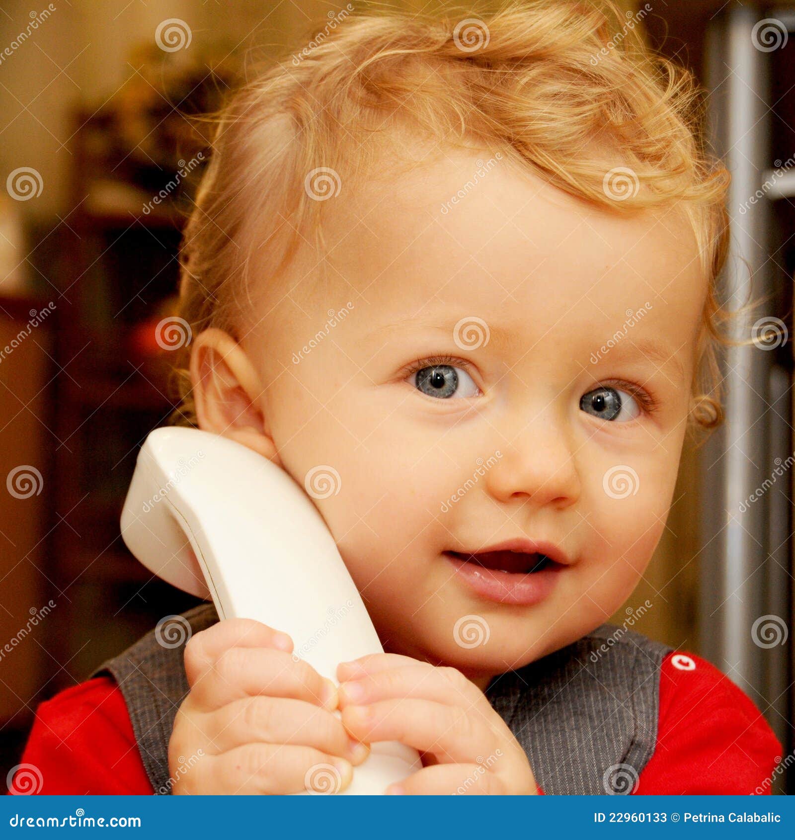 Baby at the phone stock image. Image of childhood, phone - 22960133