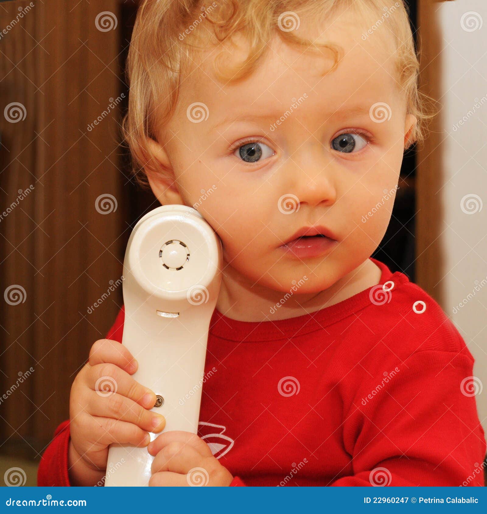 Baby at the phone stock image. Image of child, portrait - 22960247