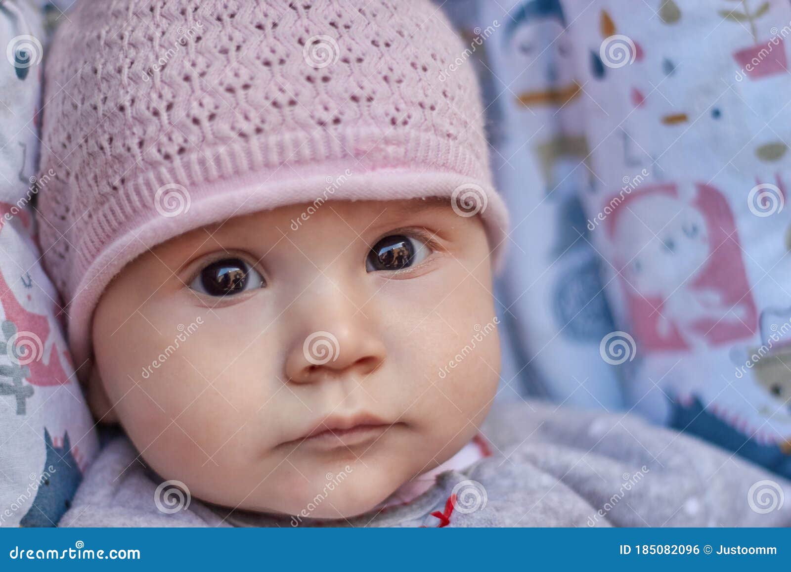 A Baby in a Pink Cap with Black Eyes Stock Photo - Image of daughter ...