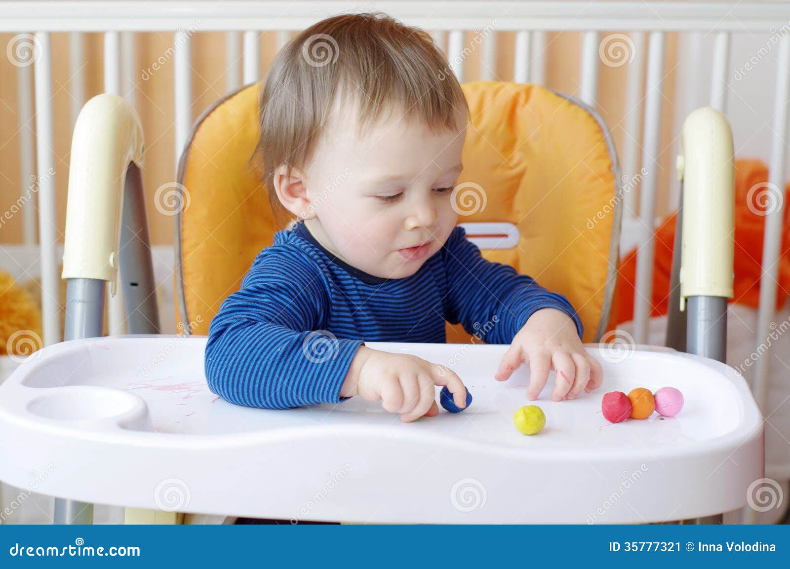 Baby with plasticine stock image. Image of nice, gorgeous - 35777321