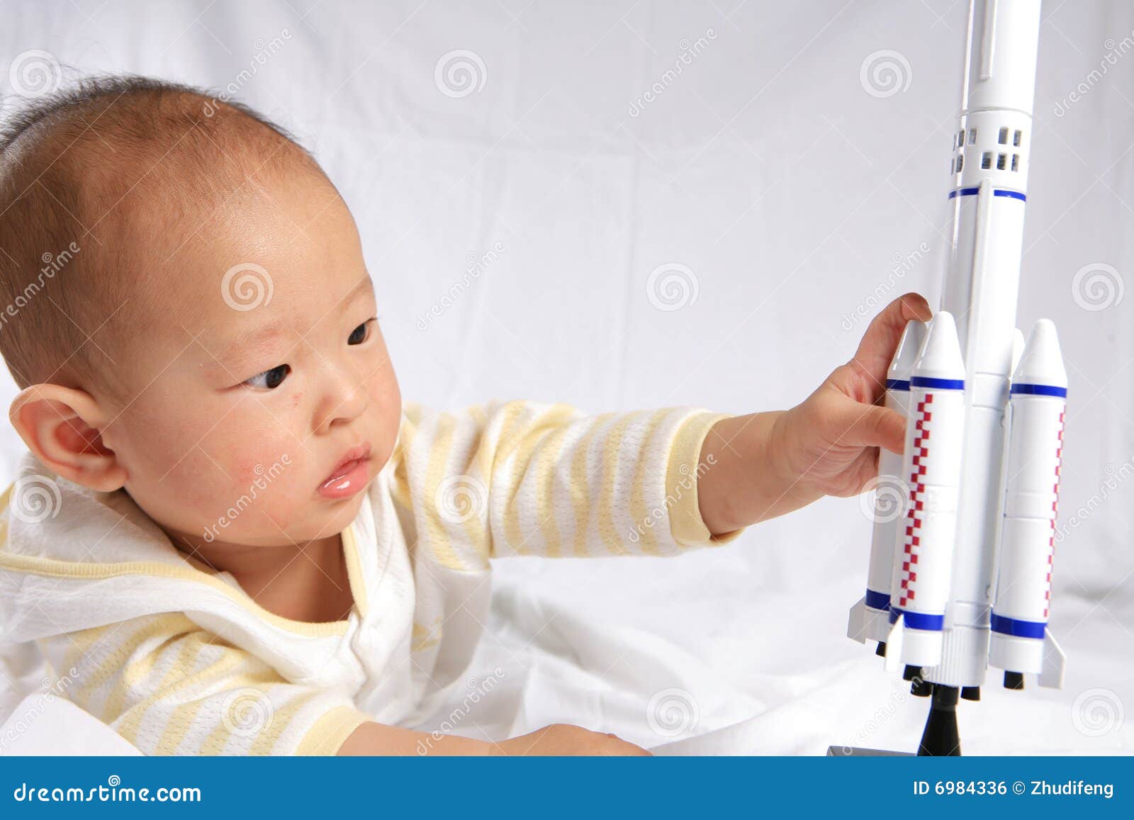 Baby Play with Rocket Model Stock Photo - Image of children, expression ...