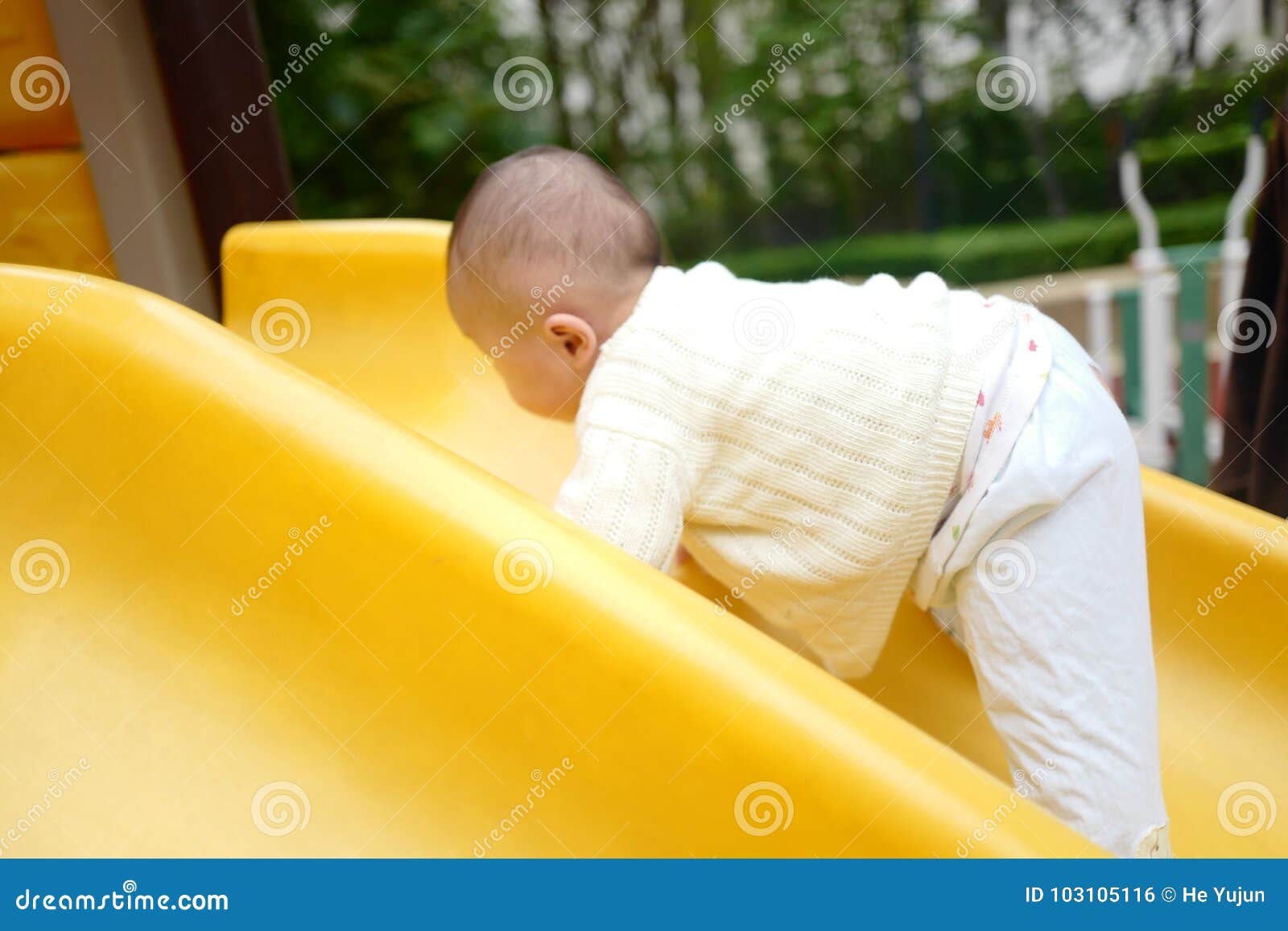 Baby on the Playground Slide Stock Photo - Image of adorable, playful ...