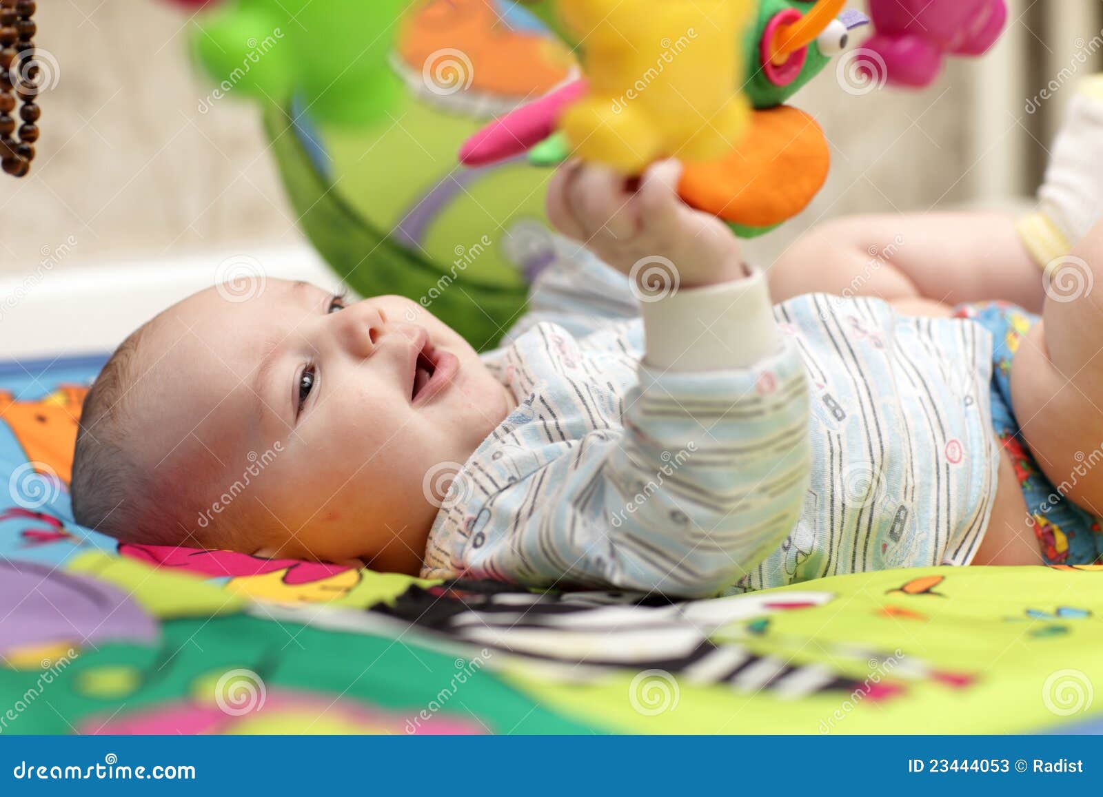 Baby playing stock image. Image of looking, lying, hand - 23444053