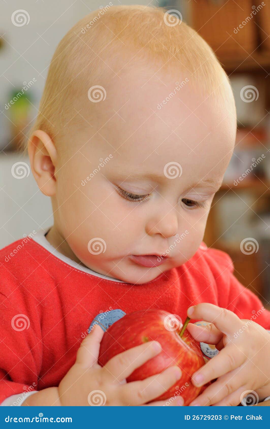 Baby playing with apple stock image. Image of cute, adorable - 26729203