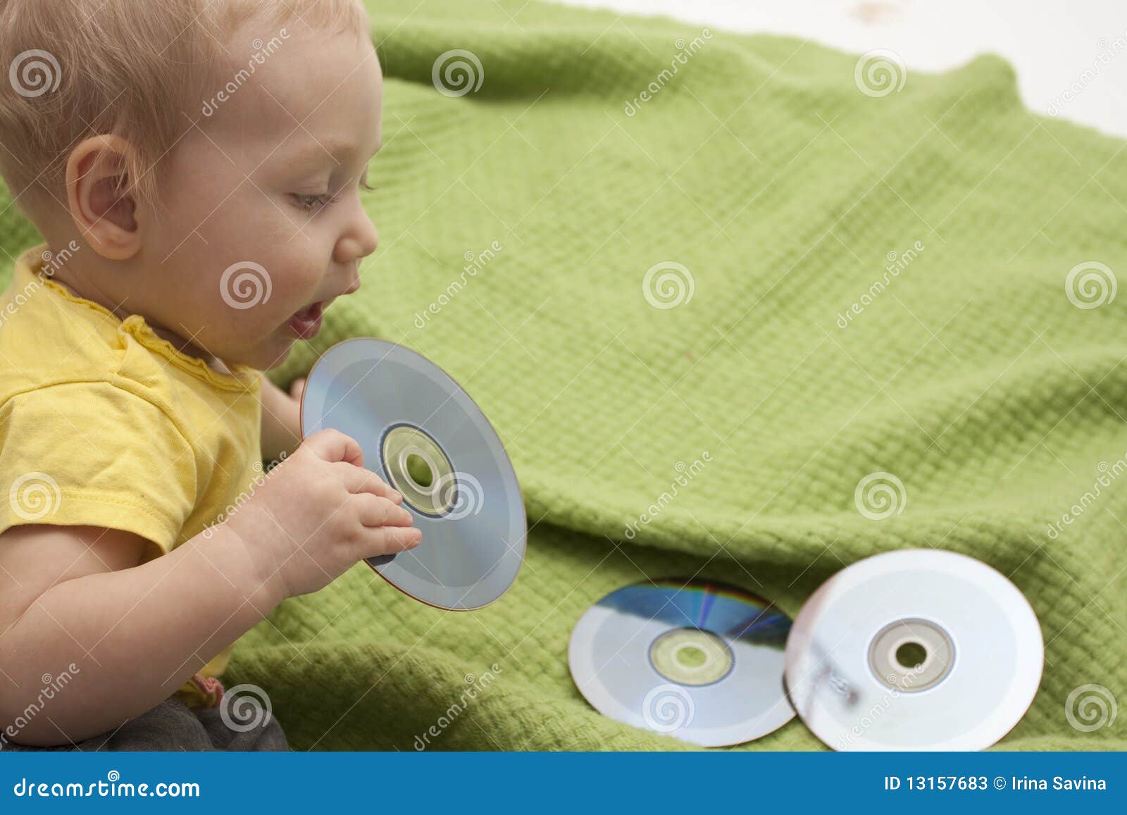 Baby is playing with cd stock image. Image of disk, eating - 13157683