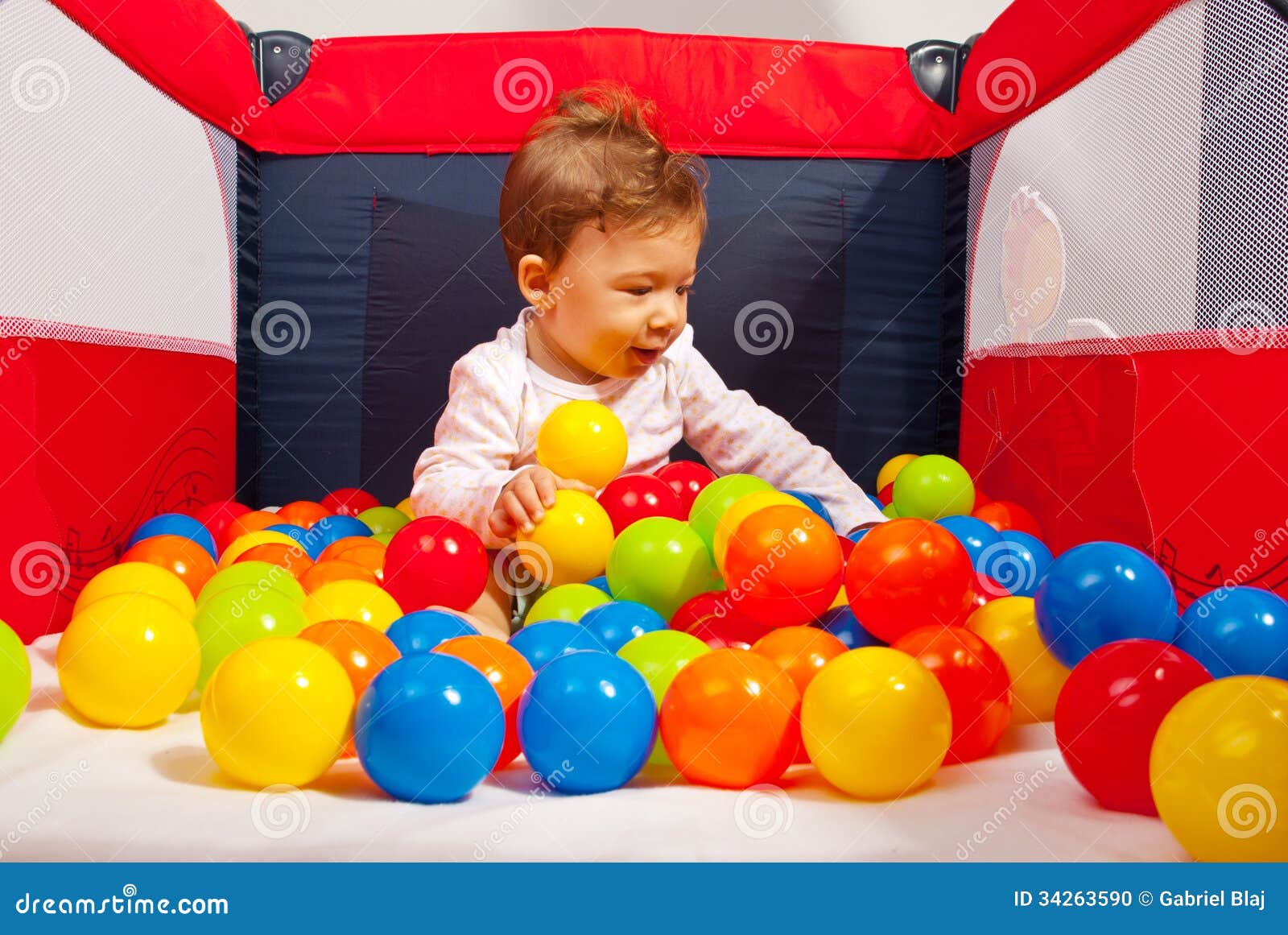 Baby Playing with Colorful Balls Stock Photo - Image of infant, leisure ...