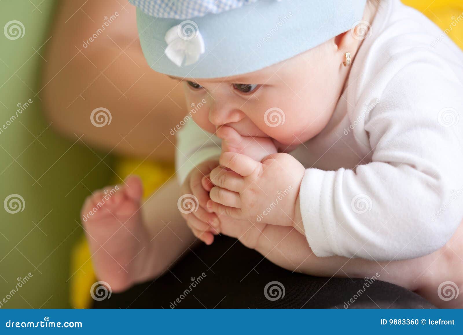 Baby playing with her foot stock photo. Image of play - 9883360