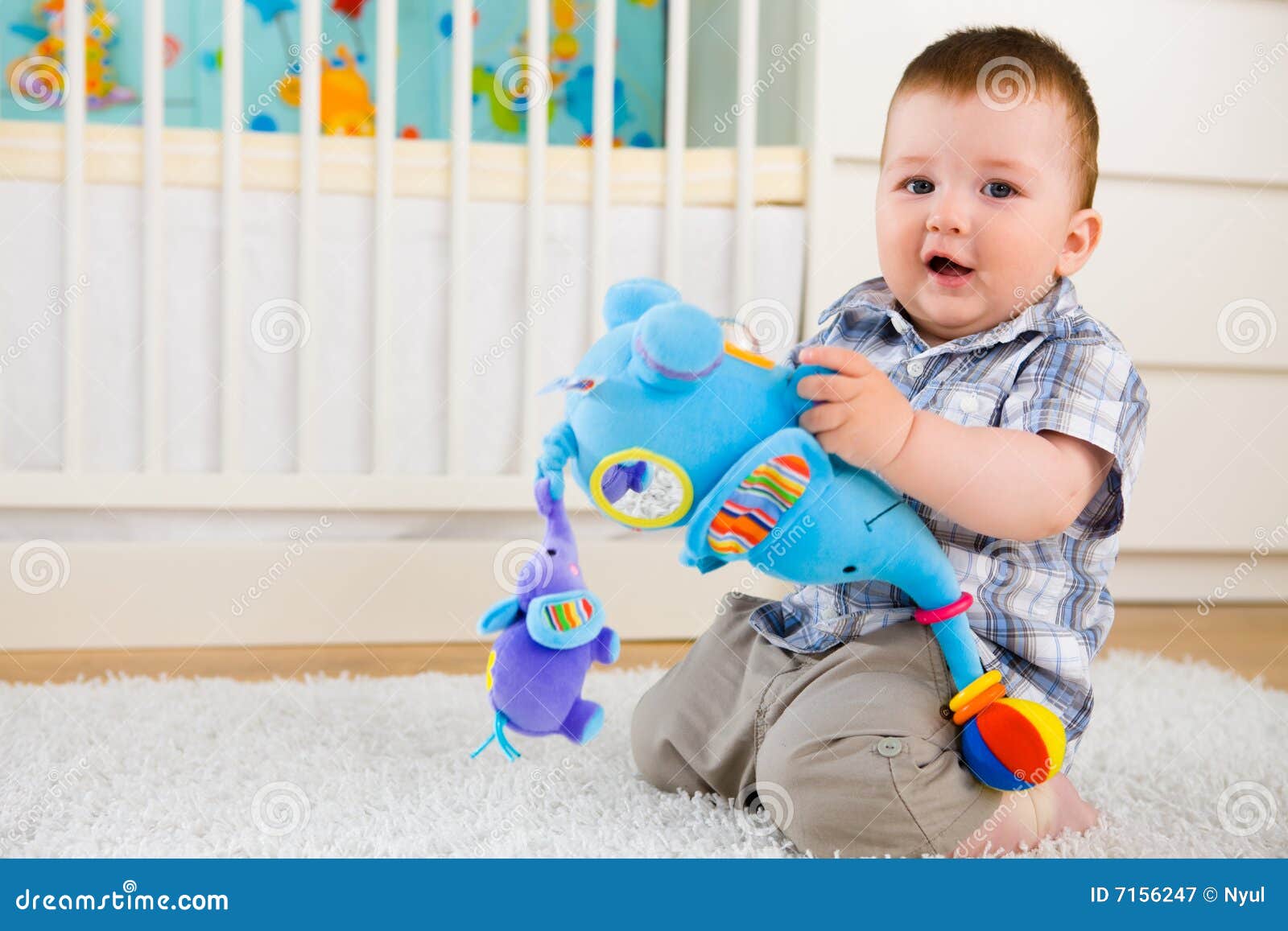 Baby playing at home stock image. Image of confident, colorful - 7156247