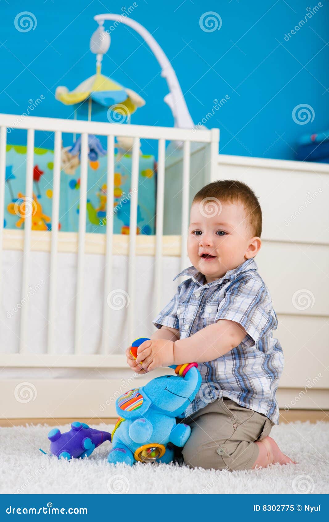 Baby playing at home stock image. Image of alone, blue - 8302775