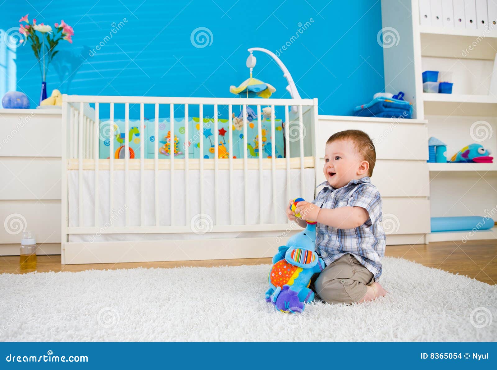 Baby playing at home stock photo. Image of adorable, blue - 8365054