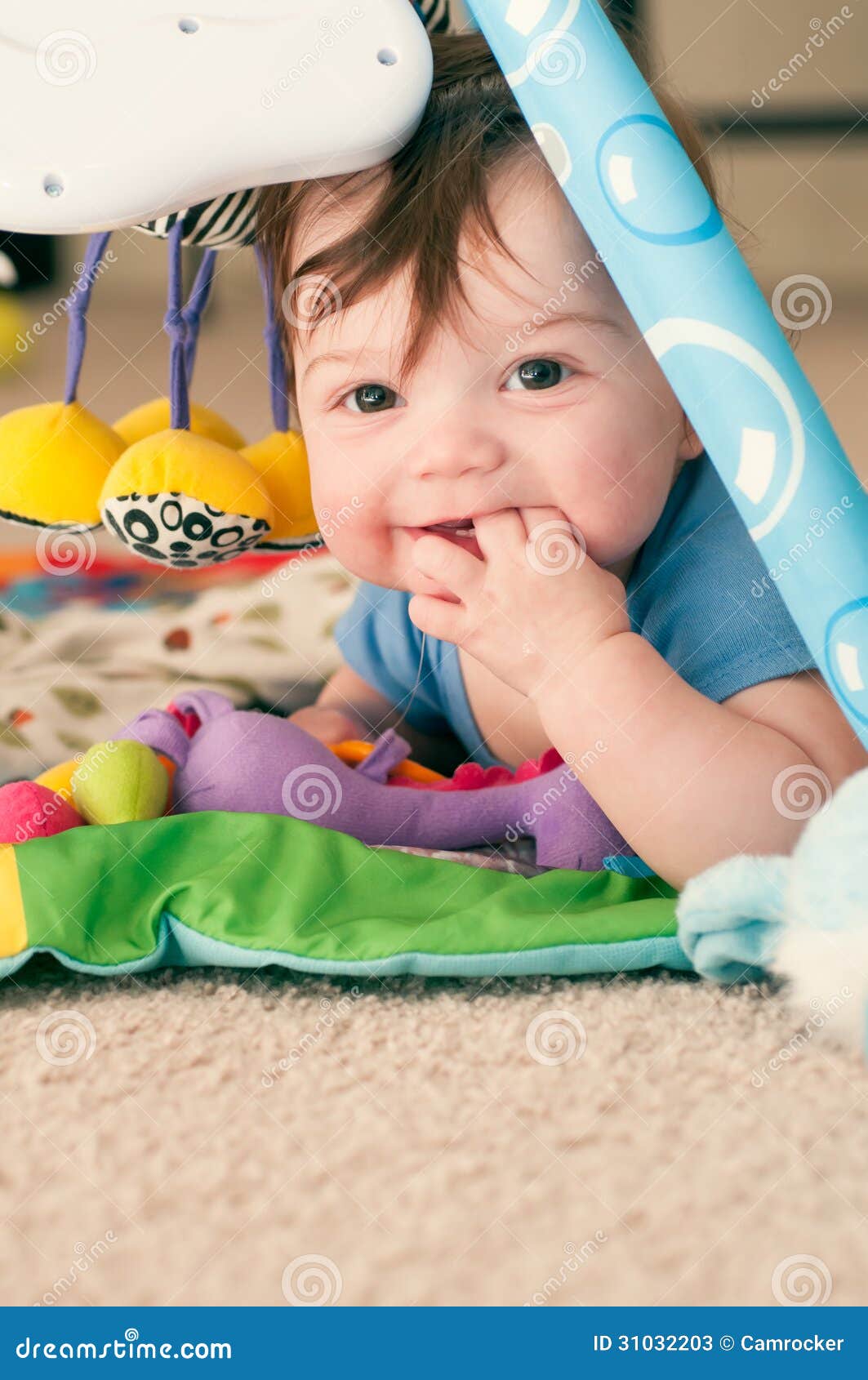 Baby Playing on a Jungle Mat Stock Image - Image of color, looking ...