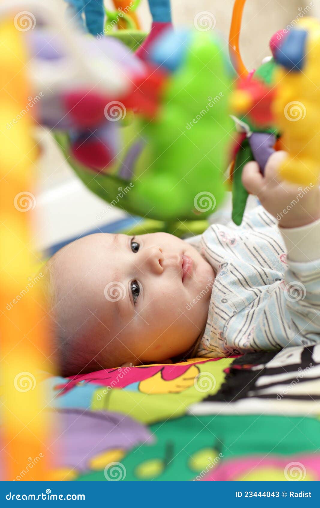 Baby on playing mat stock image. Image of person, little - 23444043