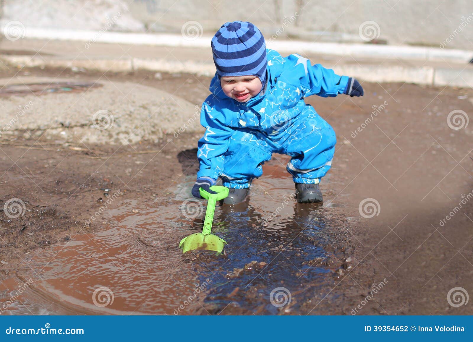 Baby playing in puddle stock photo. Image of outdoor - 39354652