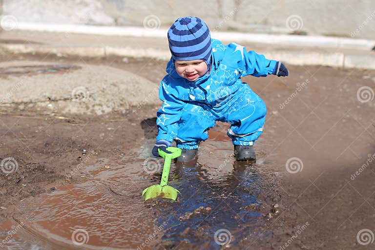 Baby playing in puddle stock photo. Image of outdoor - 39354652