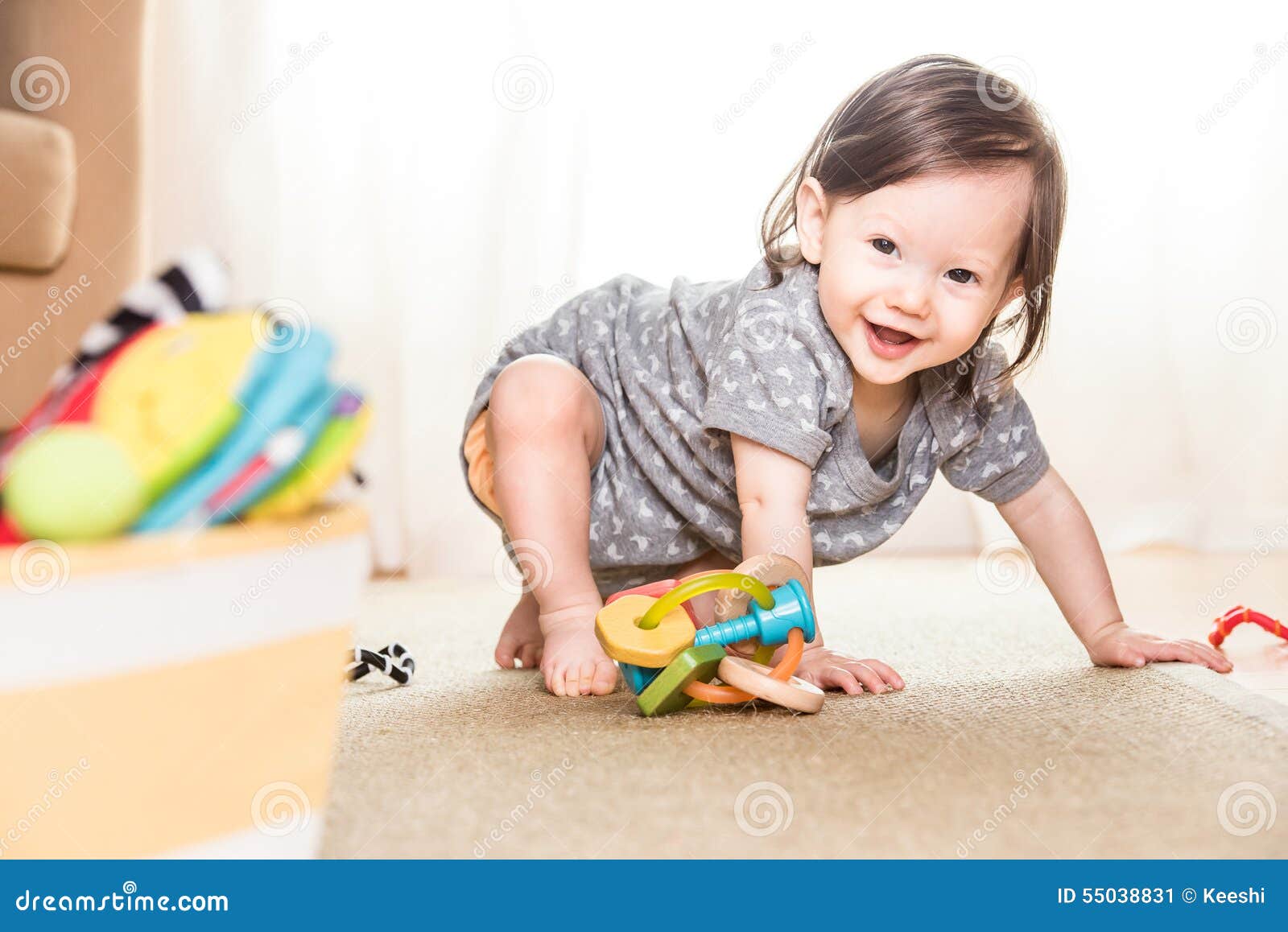 Baby Playing on Rug stock image. Image of toddler, living - 55038831
