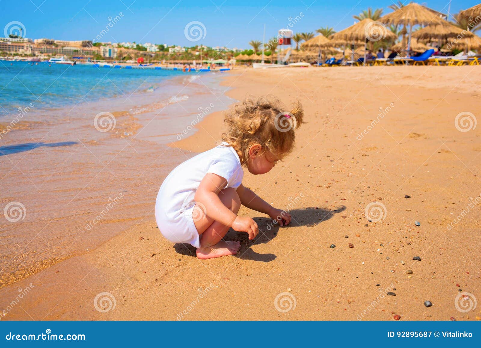 Baby Playing with Sand by the Sea Stock Image - Image of happy, people ...