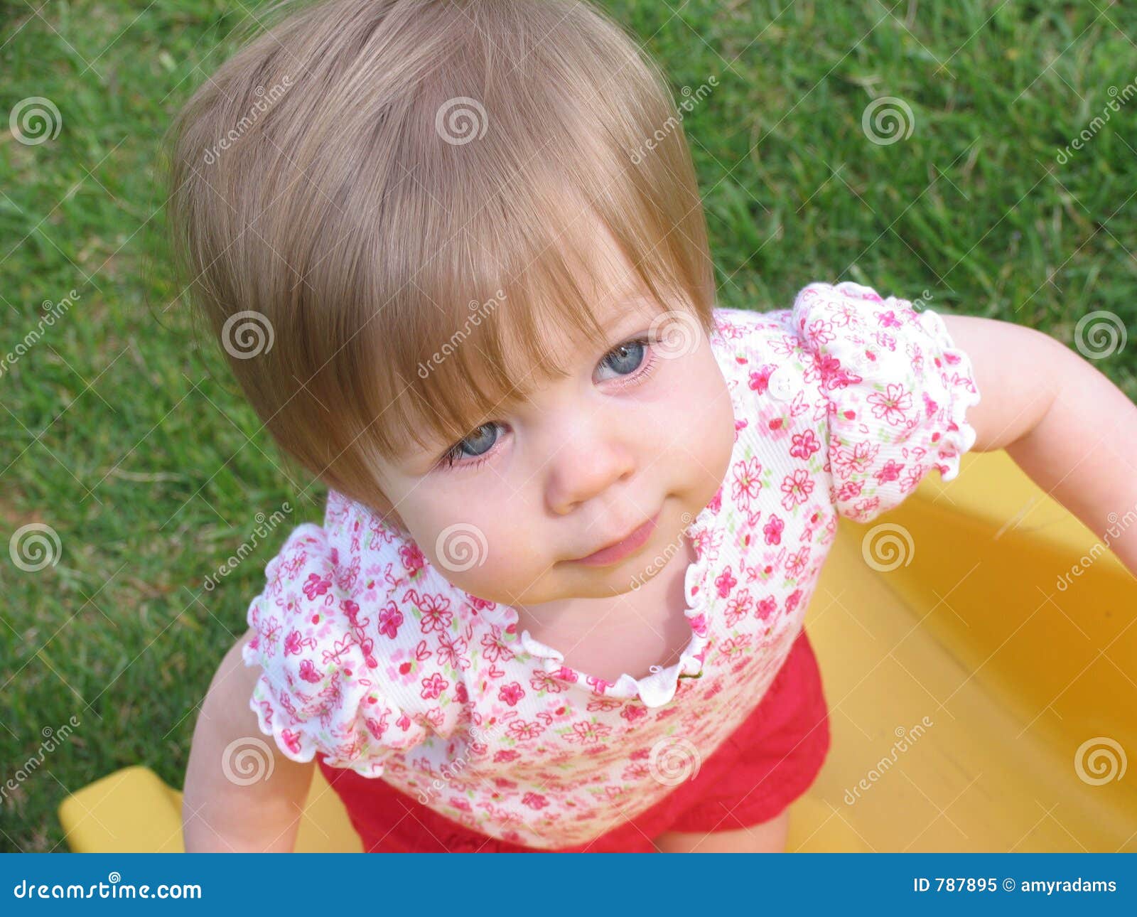 Baby playing on slide stock image. Image of pretty, green - 787895