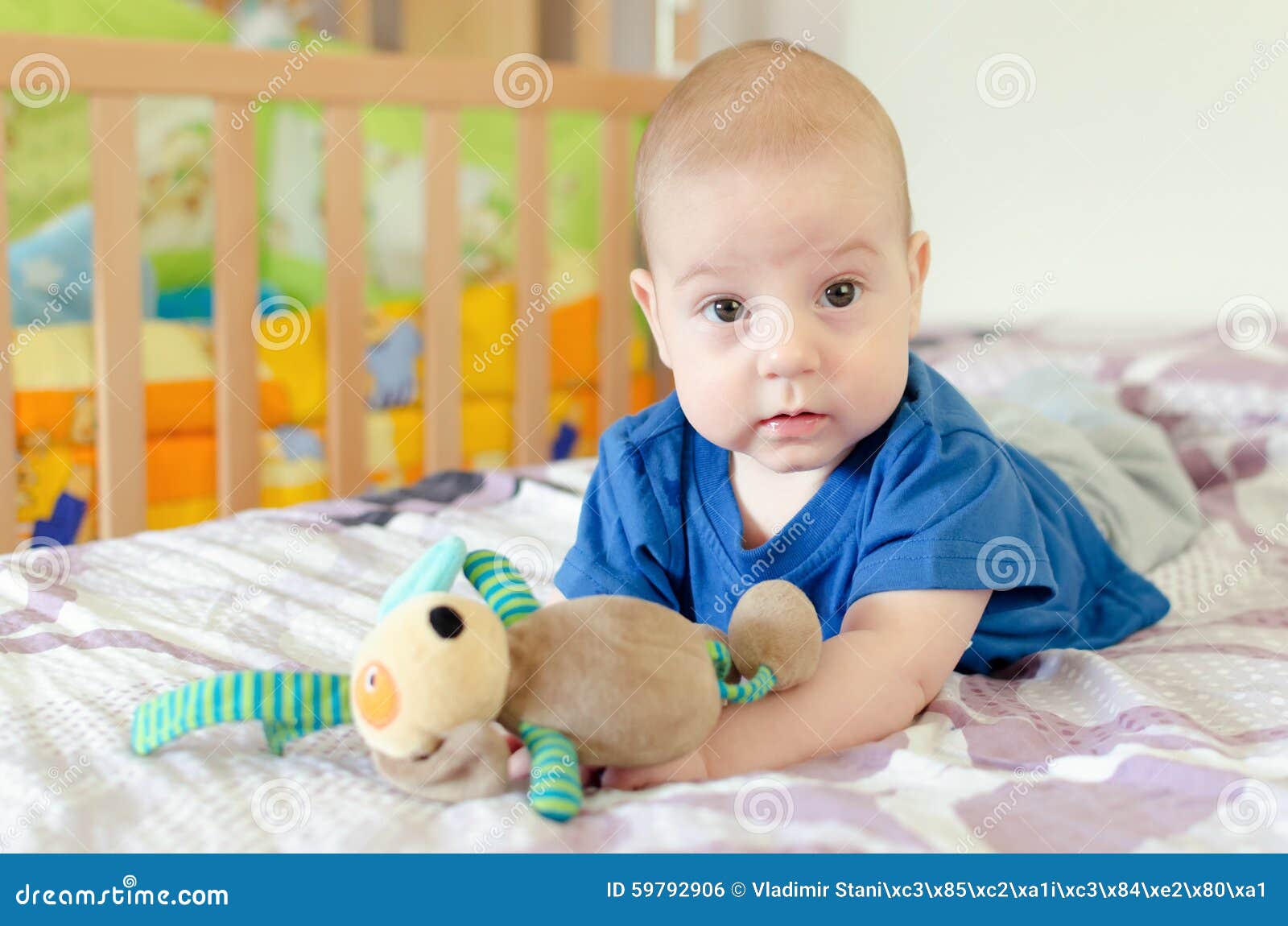 Baby Playing with Soft Toy on the Bed Stock Photo - Image of happiness ...
