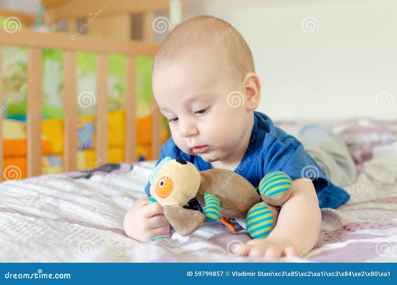 Baby Playing with Soft Toy on the Bed Stock Image - Image of cute, play ...