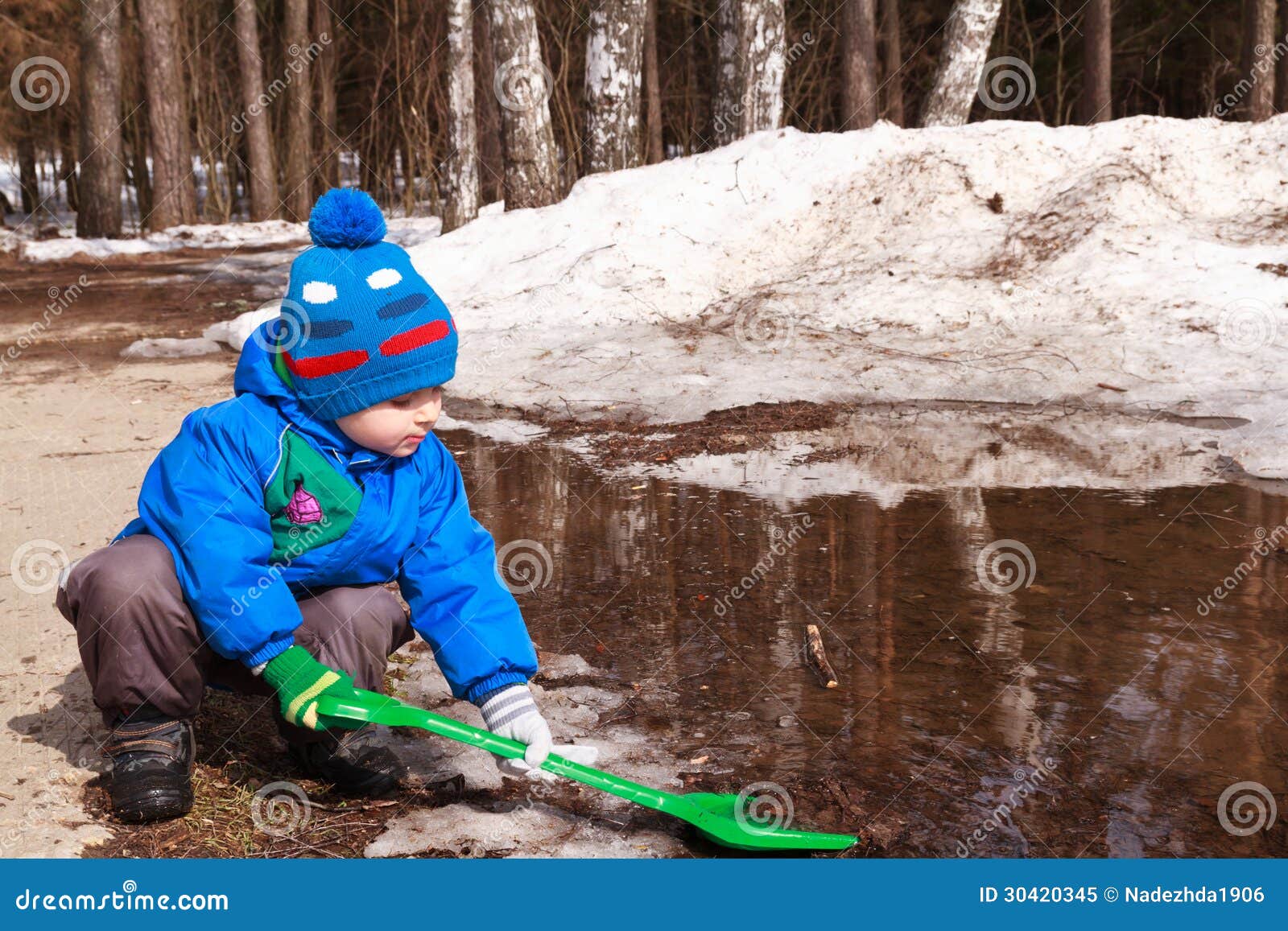 Baby playing in spring mud stock image. Image of dirt - 30420345