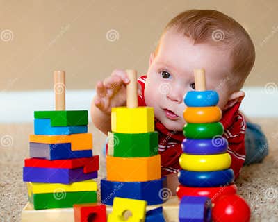 Baby Playing with Stacking Learning Toy Stock Photo - Image of ...